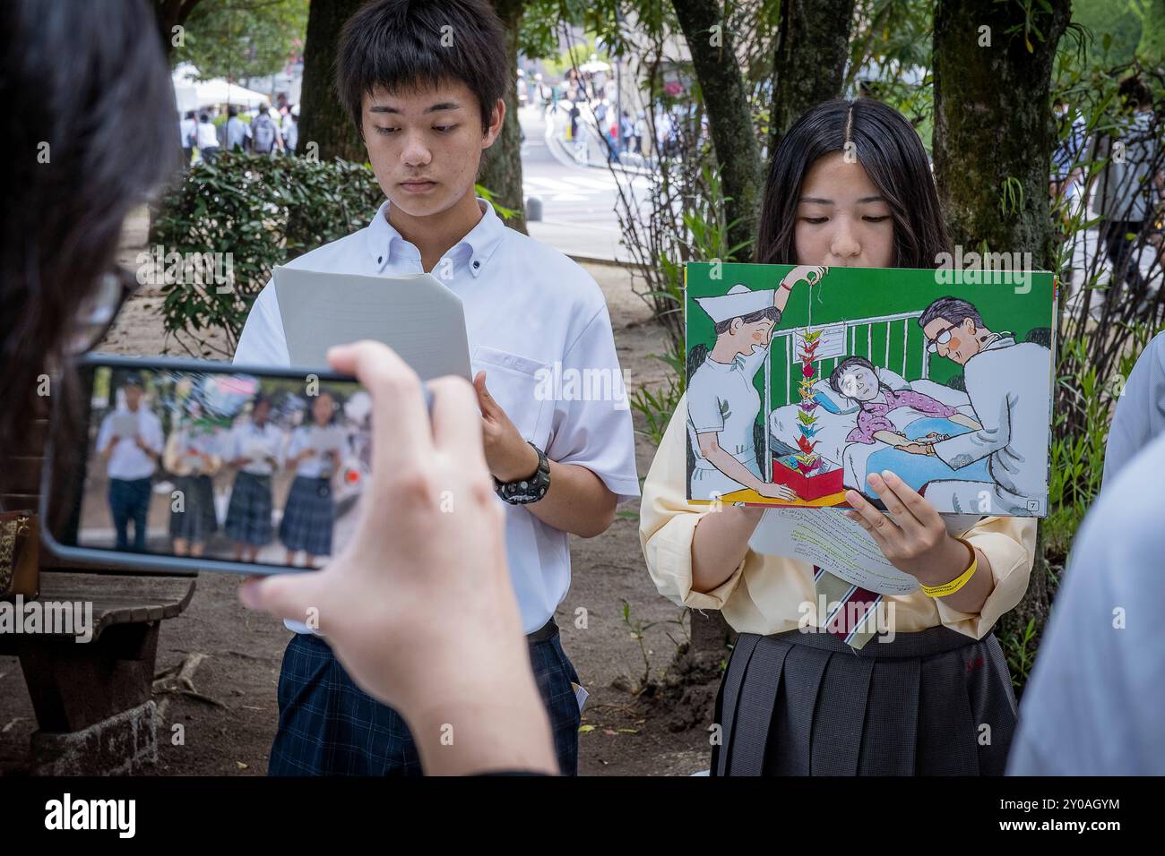Street performance, students explain to passers-by the story of Sadako ...