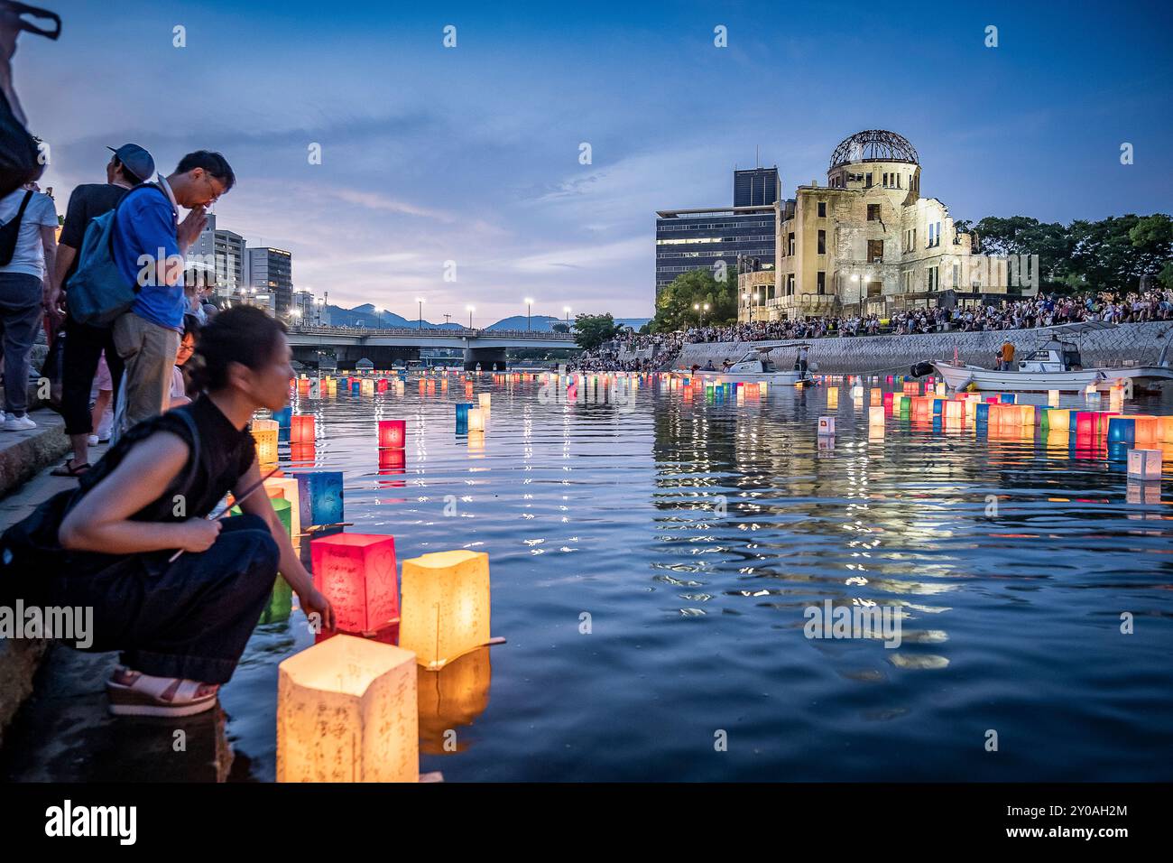 Wpman float lanterns on the river, in front of Atomic Bomb Dome with ...