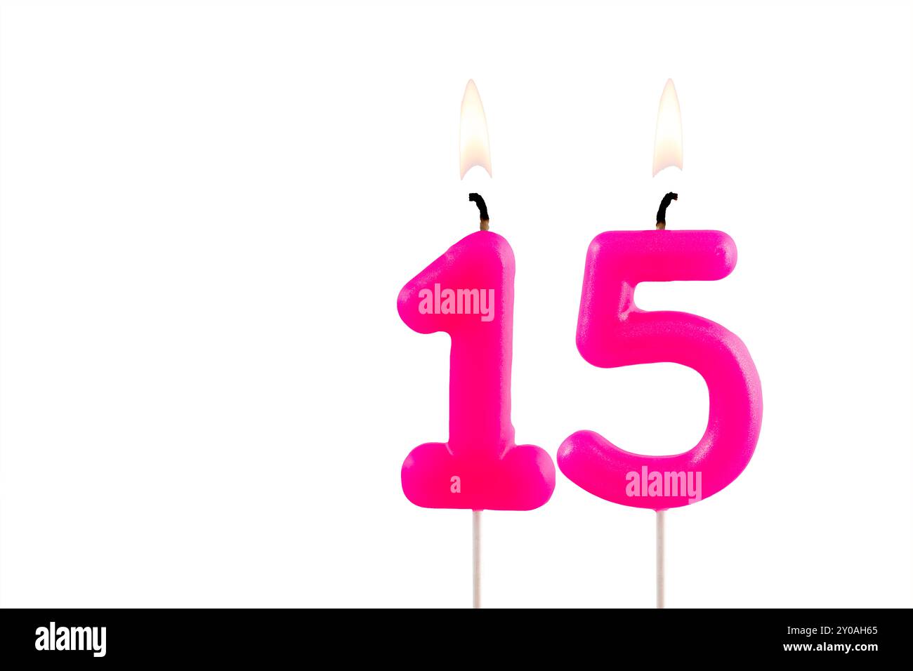 Pink number 15 birthday candle on white background Stock Photo - Alamy