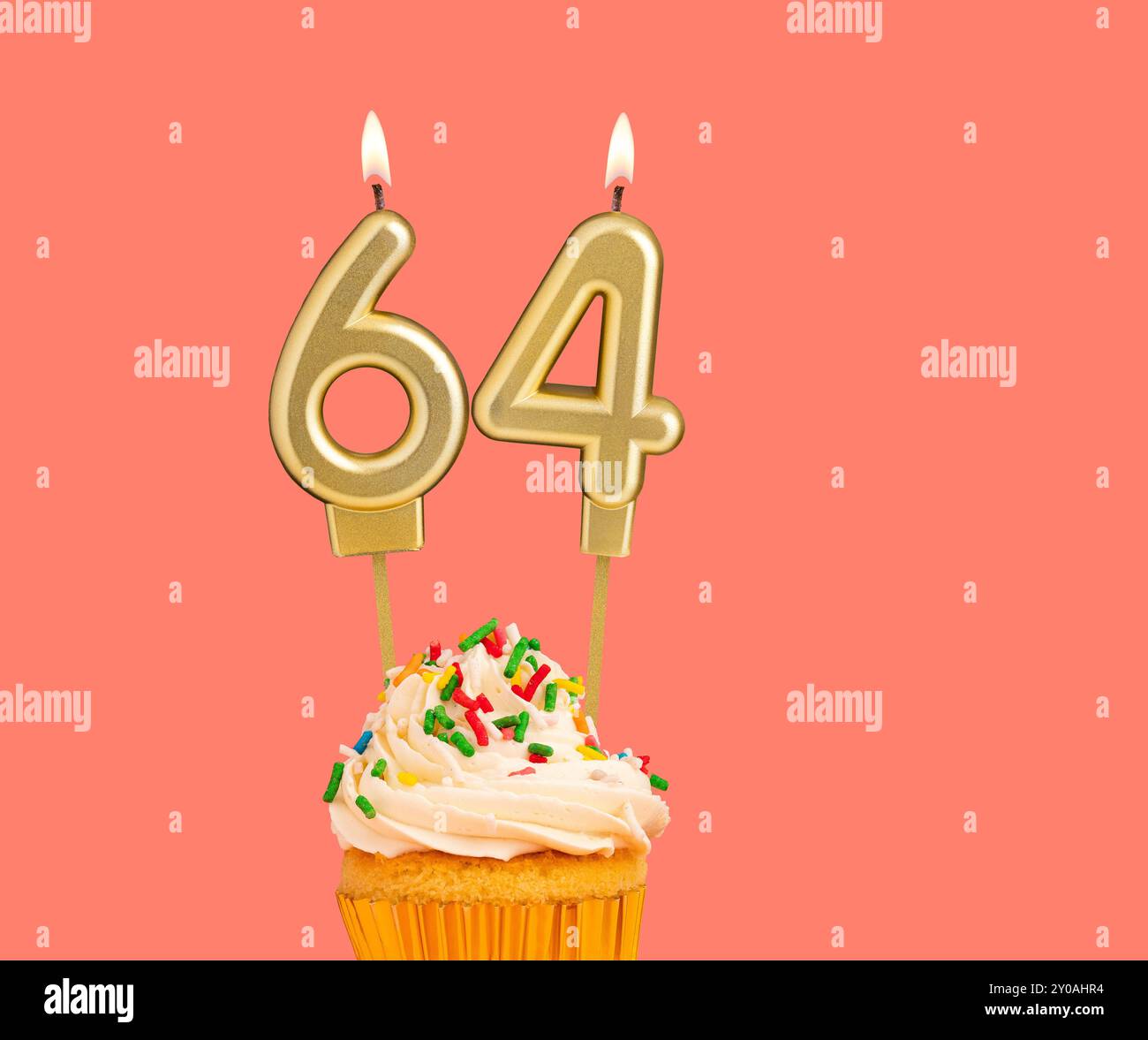 Birthday candle and cupcake - Number 64 Stock Photo - Alamy
