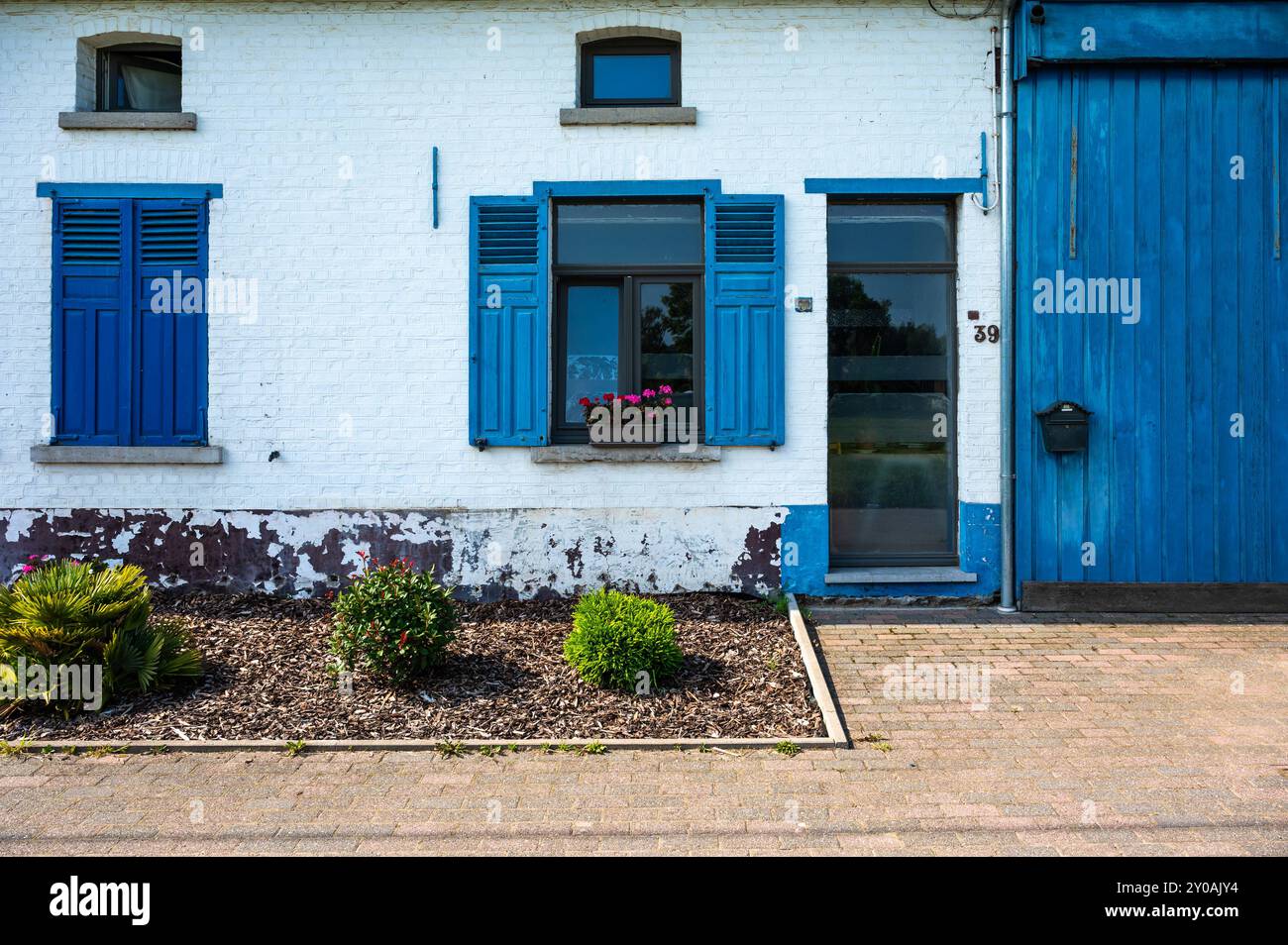 Ternat, Flemish Brabant, Belgium, August 31, 2024 - Blue facade with ...
