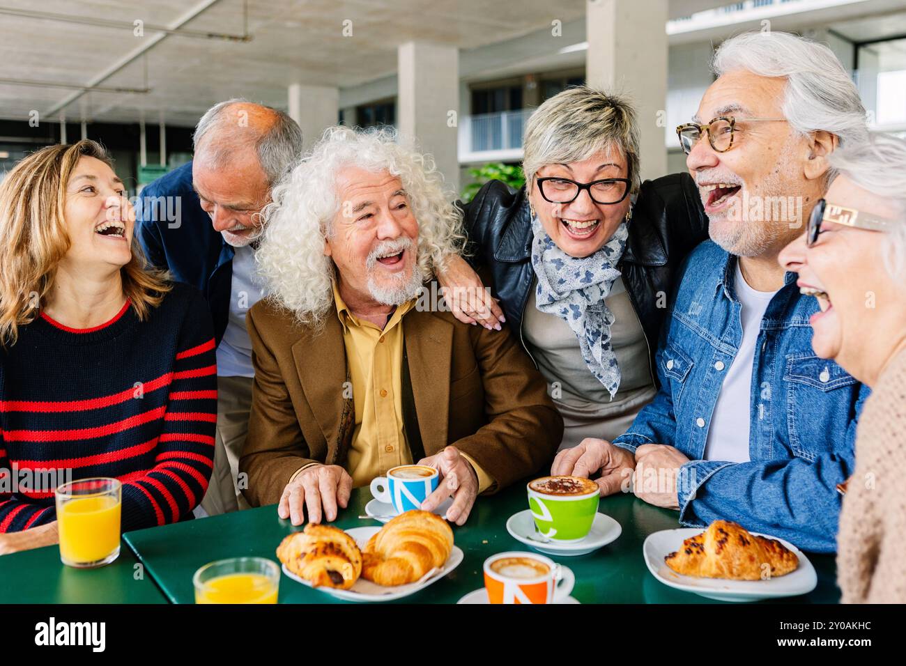 Diverse group friends celebrate talk hi-res stock photography and ...