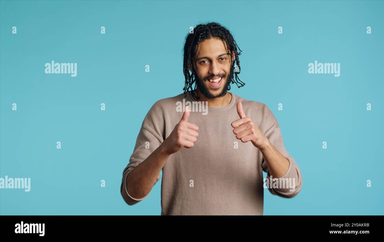 Man doing thumbs up hand gesturing, showing approval, having positive ...