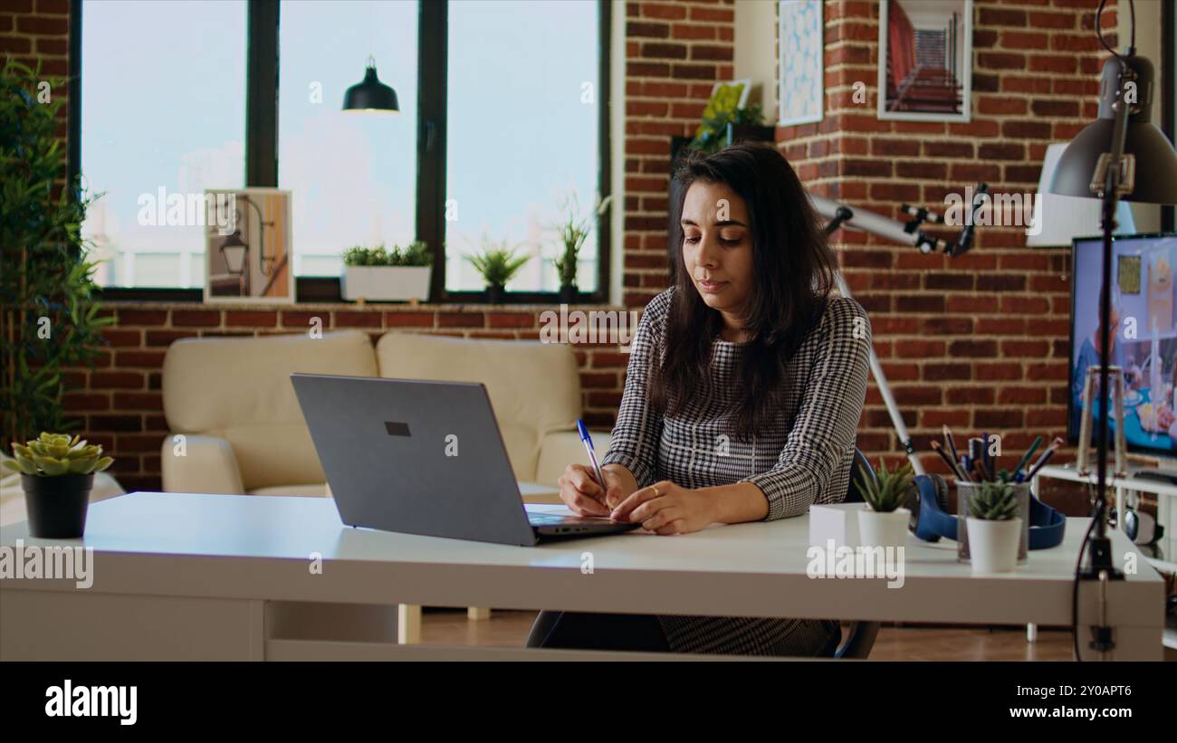 Woman multitasking between remote hi-res stock photography and images ...