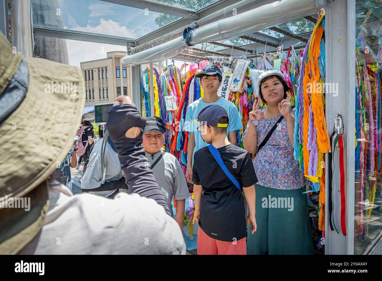 Children doing a offering and taking a picture, in Peace Monument of ...