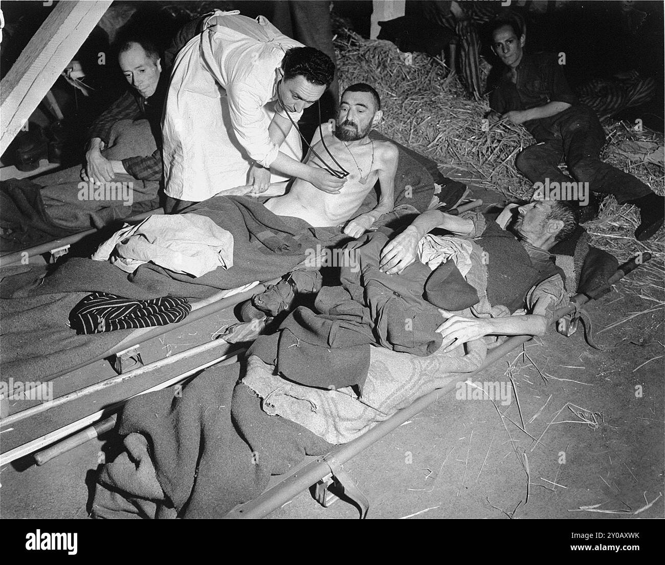 French survivors from Woebbelin are examined by a Polish doctor after ...