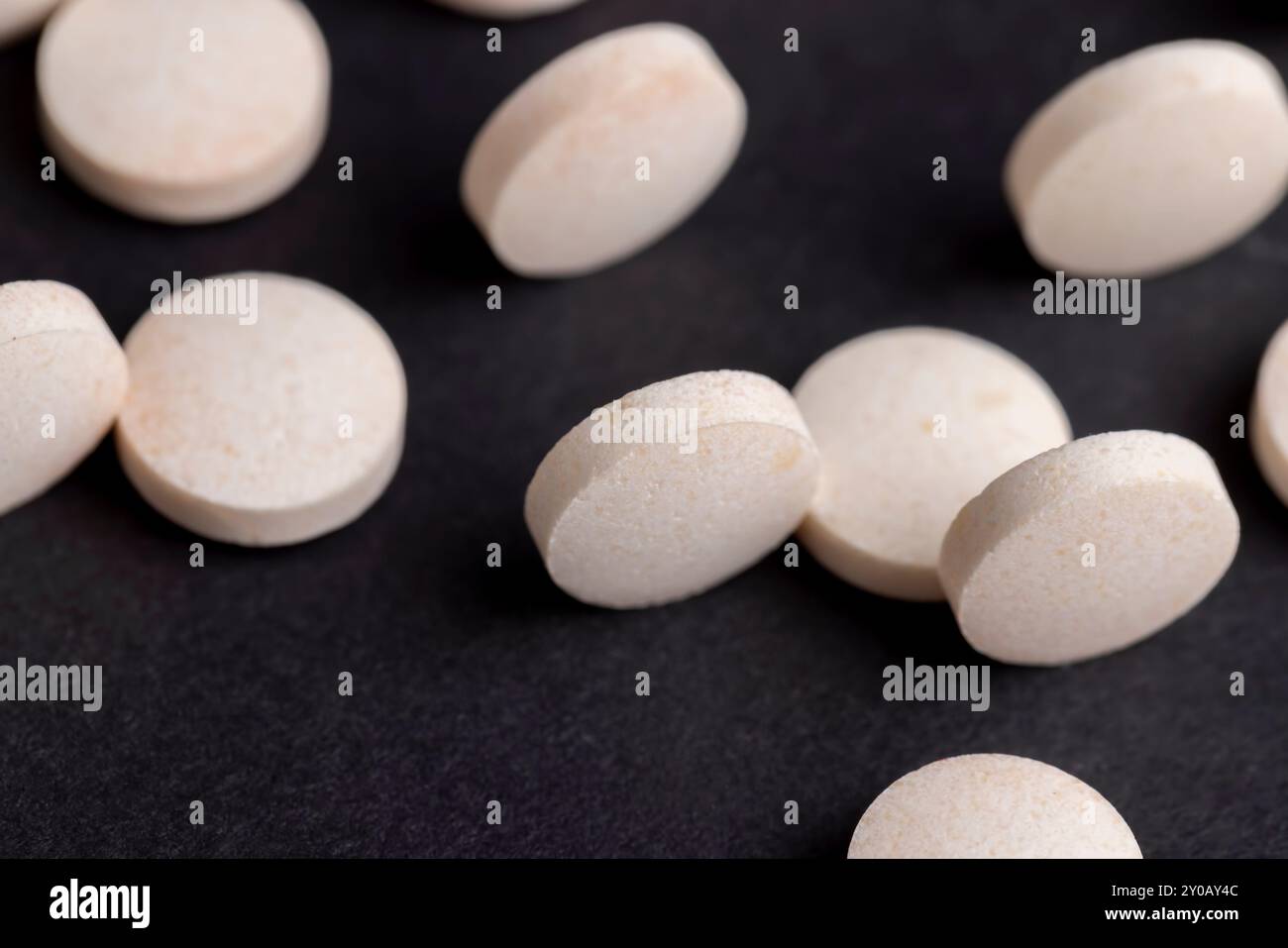 Open and unpacked tablets close-up, a large number of identical medical ...