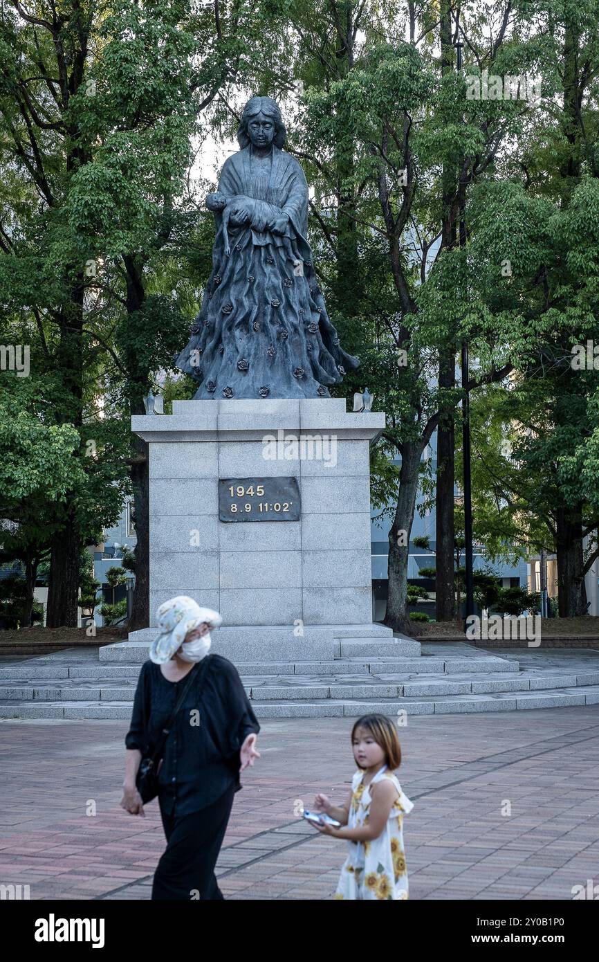 Peace park. Memorial statue of woman carrying a dead child, infant, in ...