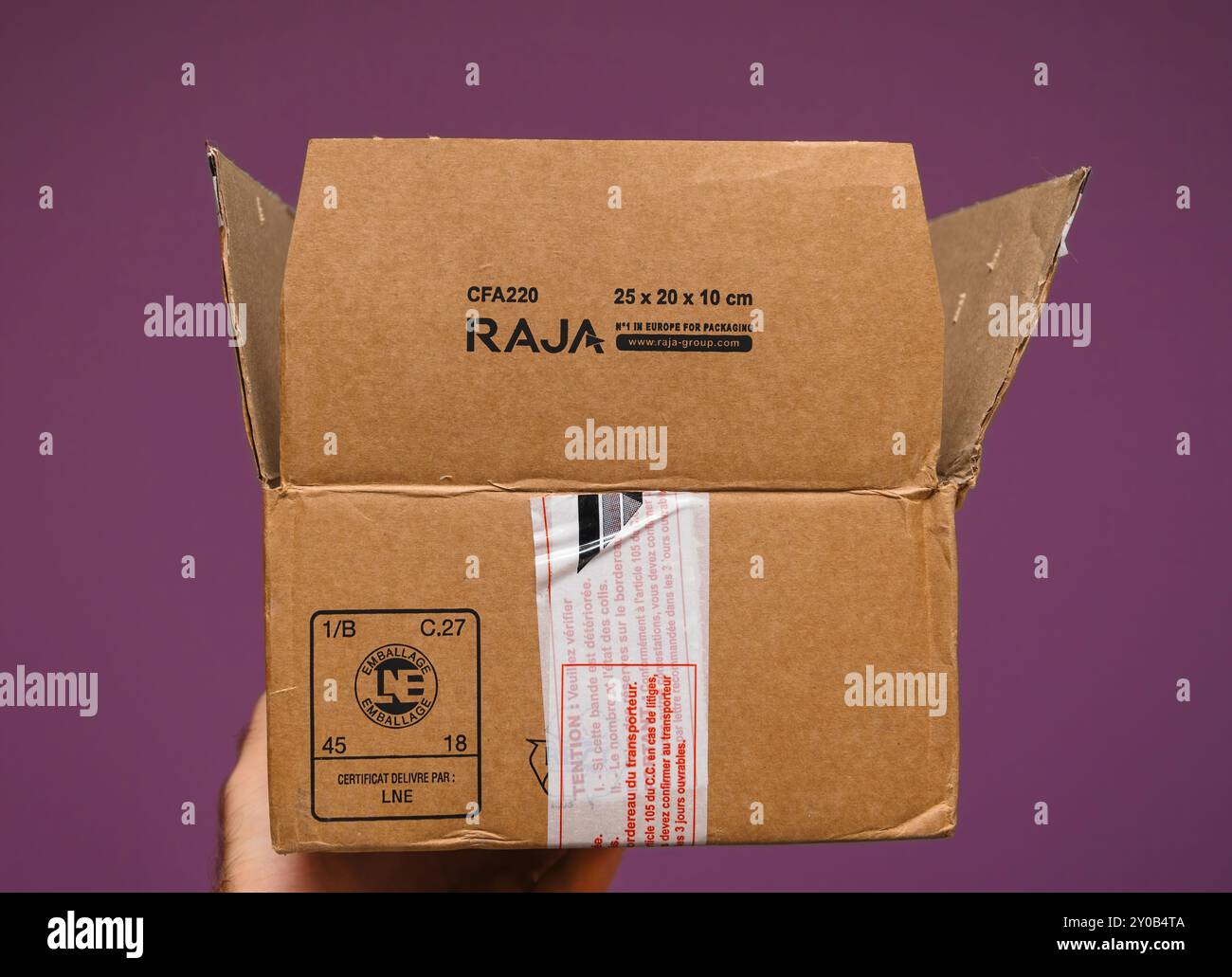 Berlin, Germany - Oct, 22, 2019: A hand holding an open Raja cardboard ...
