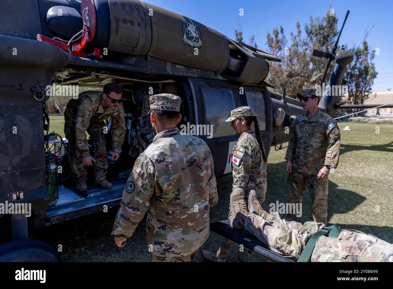 Texas Army National Guard and Chilean army soldiers load a litter on a ...