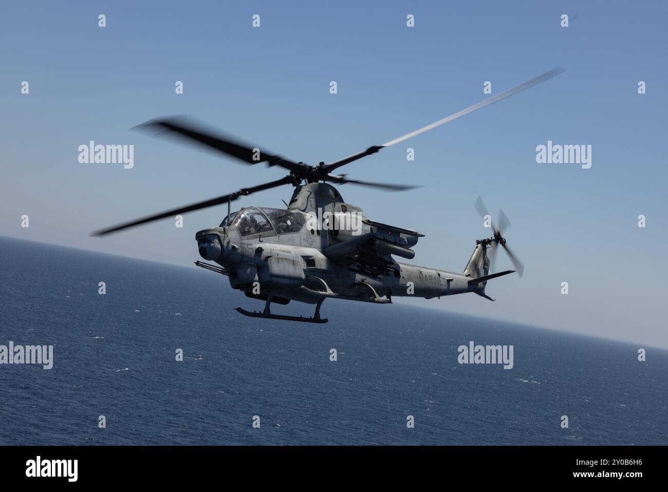 A U.S. Marine Corps AH-1Z Cobra helicopter with Marine Medium Tiltrotor ...