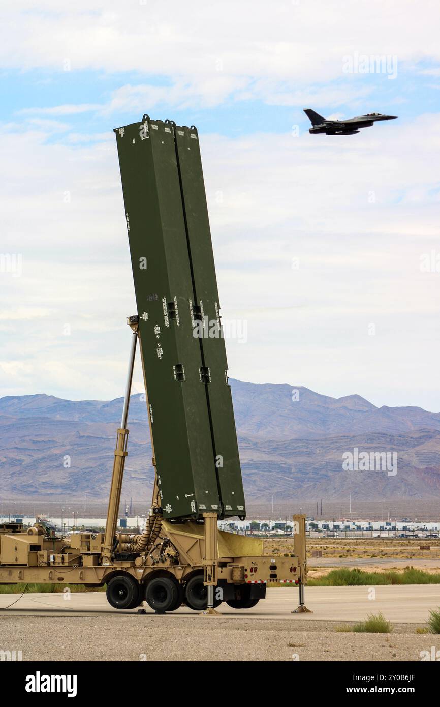 A U.S. Air Force F-16 Fighting Falcon flies by one of the Long Range ...