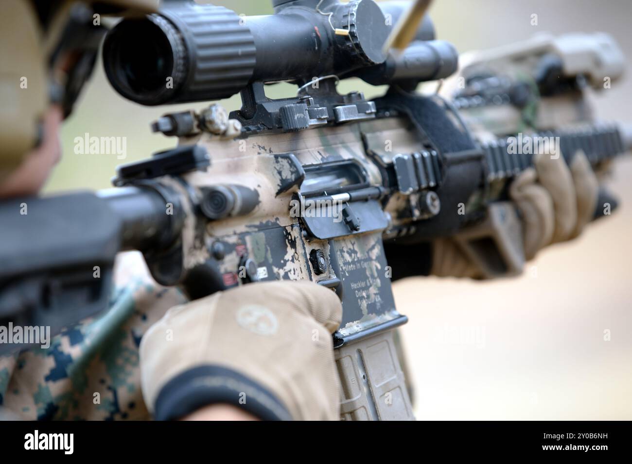 A U.S. Marine aims his M4 carbine at a target during a U.S. Marines ...