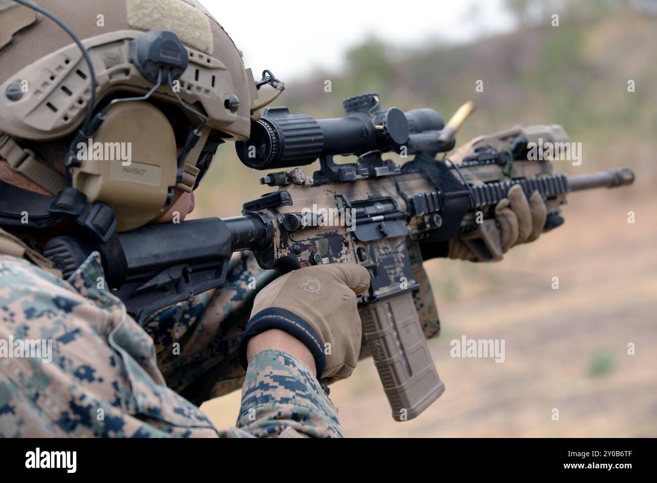 A U.S. Marine fires his M4 carbine at a target during a U.S. Marines live fire exercise in ...
