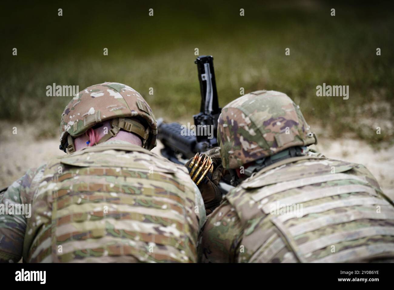 Army Reserve Best Squad competitors reload an M240B machine gun during ...