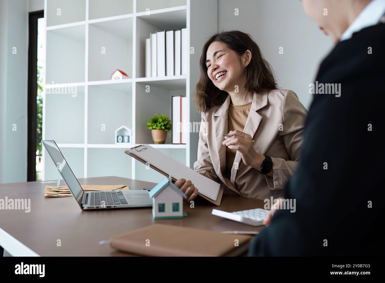 Professional Real Estate Agent Discussing Property Details with Client ...