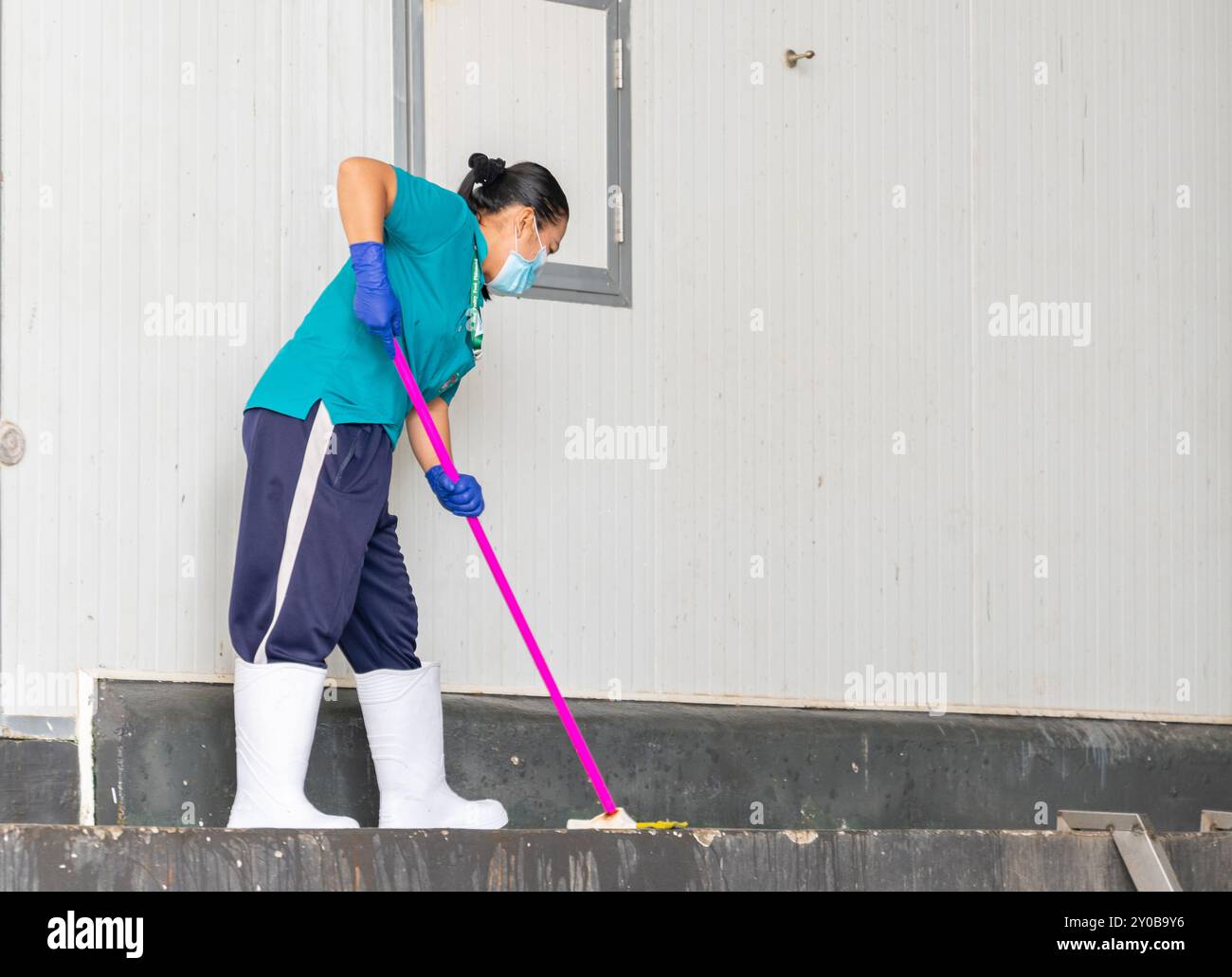 Worker sweeping floor in hi-res stock photography and images - Alamy