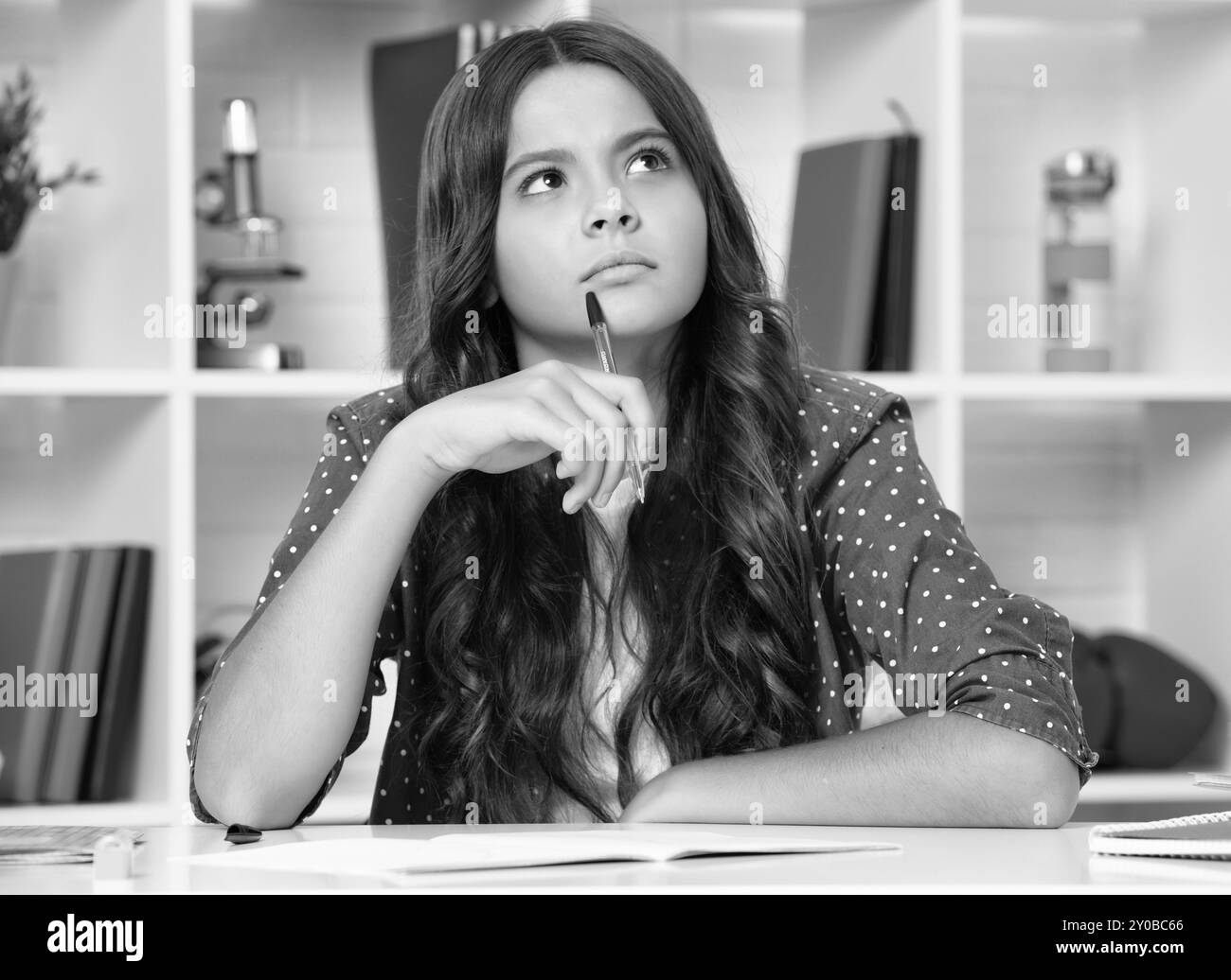 Teen writing in notebook classroom Black and White Stock Photos ...