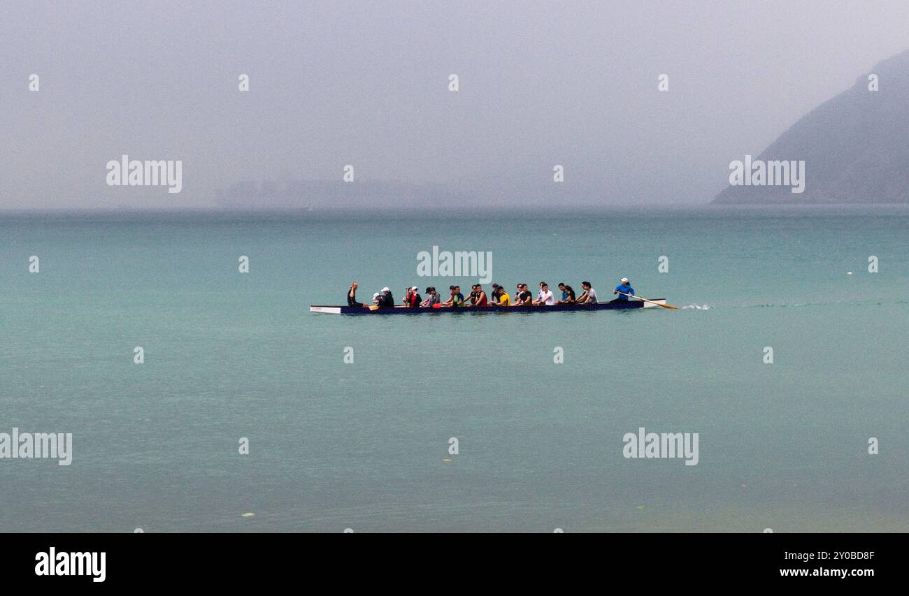 A Dragon boat team practicing for a race. Deep water Bay, Hong Kong ...