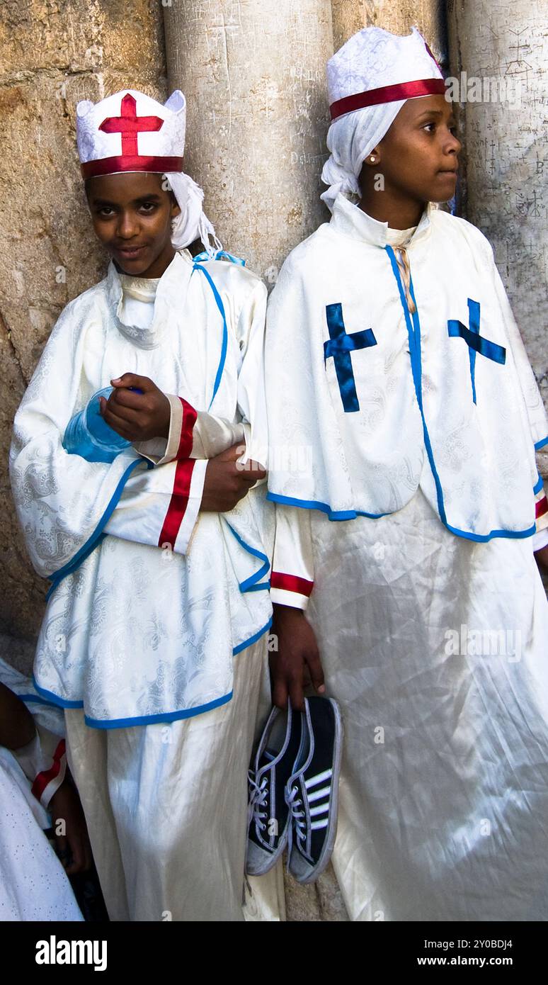 Eritrean nuns / pilgrims standing by the gate of the church of the holy ...