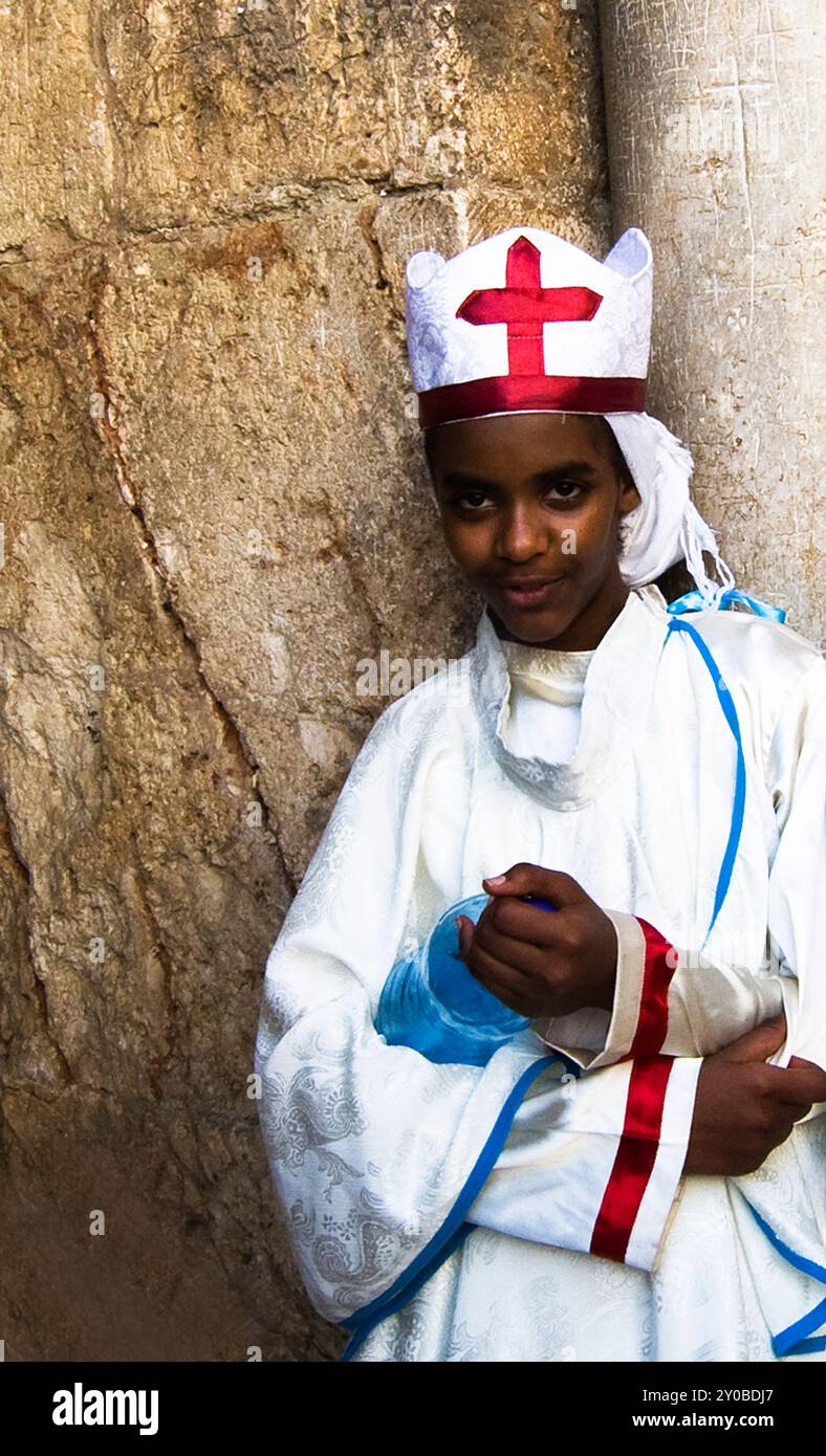 Eritrean nuns / pilgrims standing by the gate of the church of the holy ...