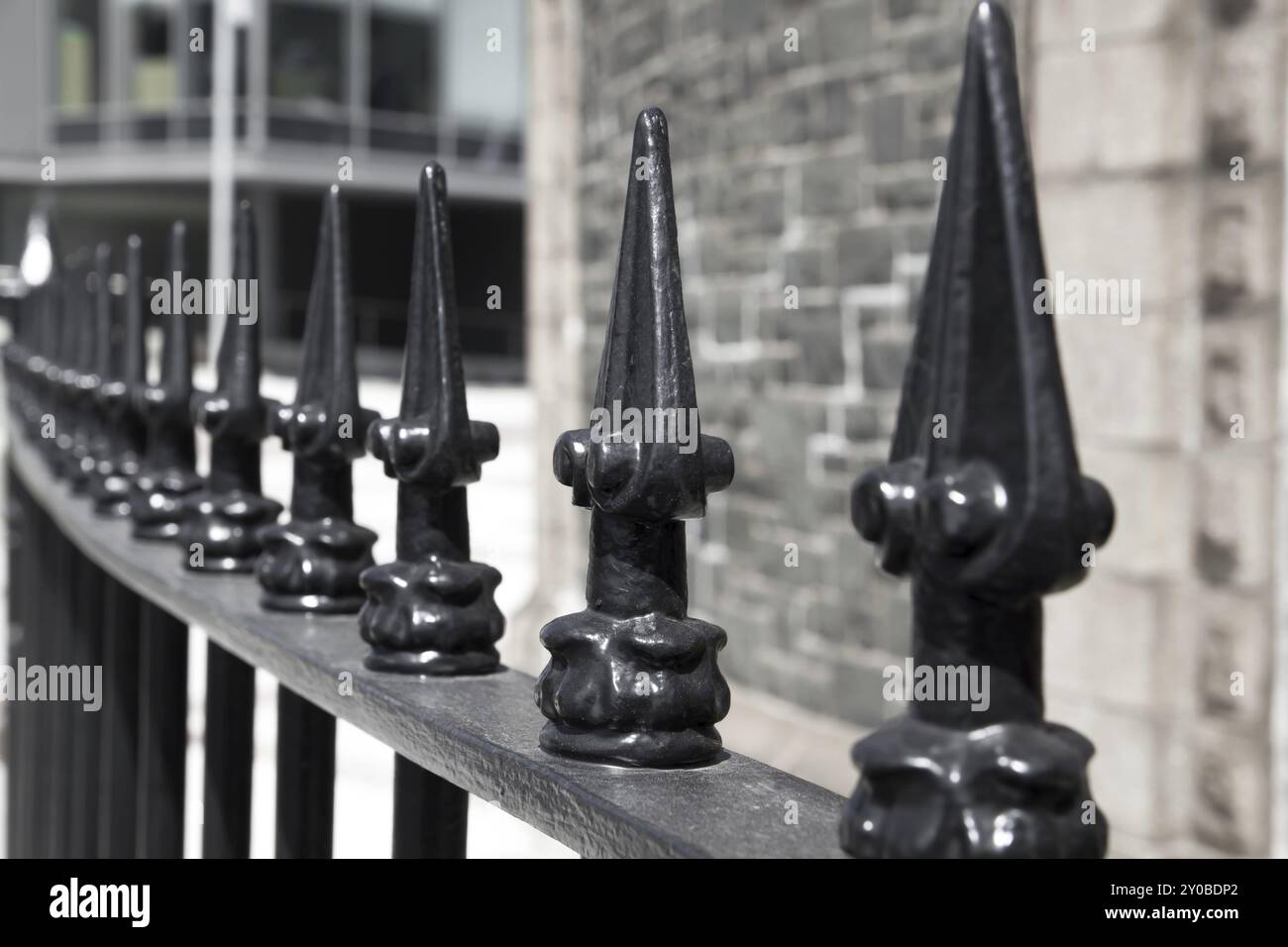 Wrought iron fence with spikes Stock Photo - Alamy