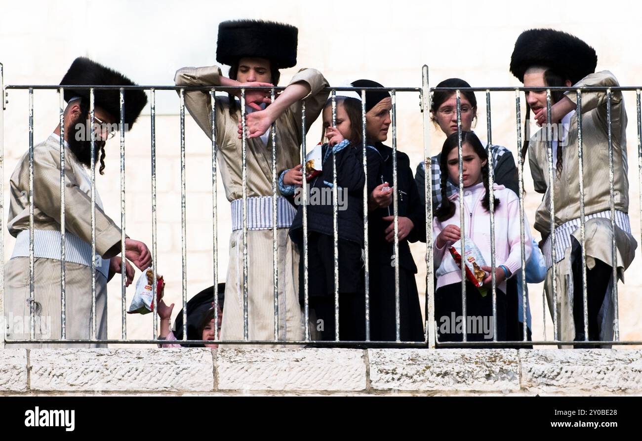 An Orthodox Jewish family dressed up for the Passover holiday. Jewish ...