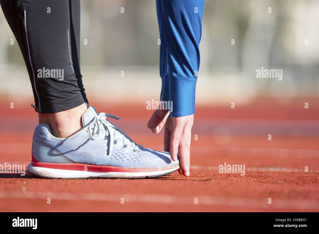 Sportsman stretching sports place hi-res stock photography and images ...