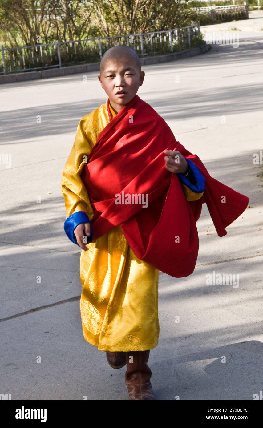 A young Buddhist monk at the Gandantegchinlen Monastery in Ulaanbaatar ...