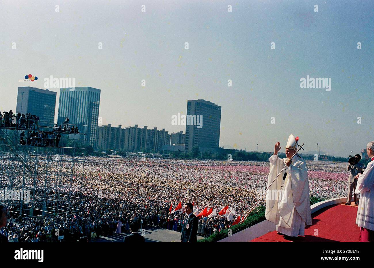 FILE- Pope John Paul II waves as he arrives for Sunday Mass in Seoul's ...