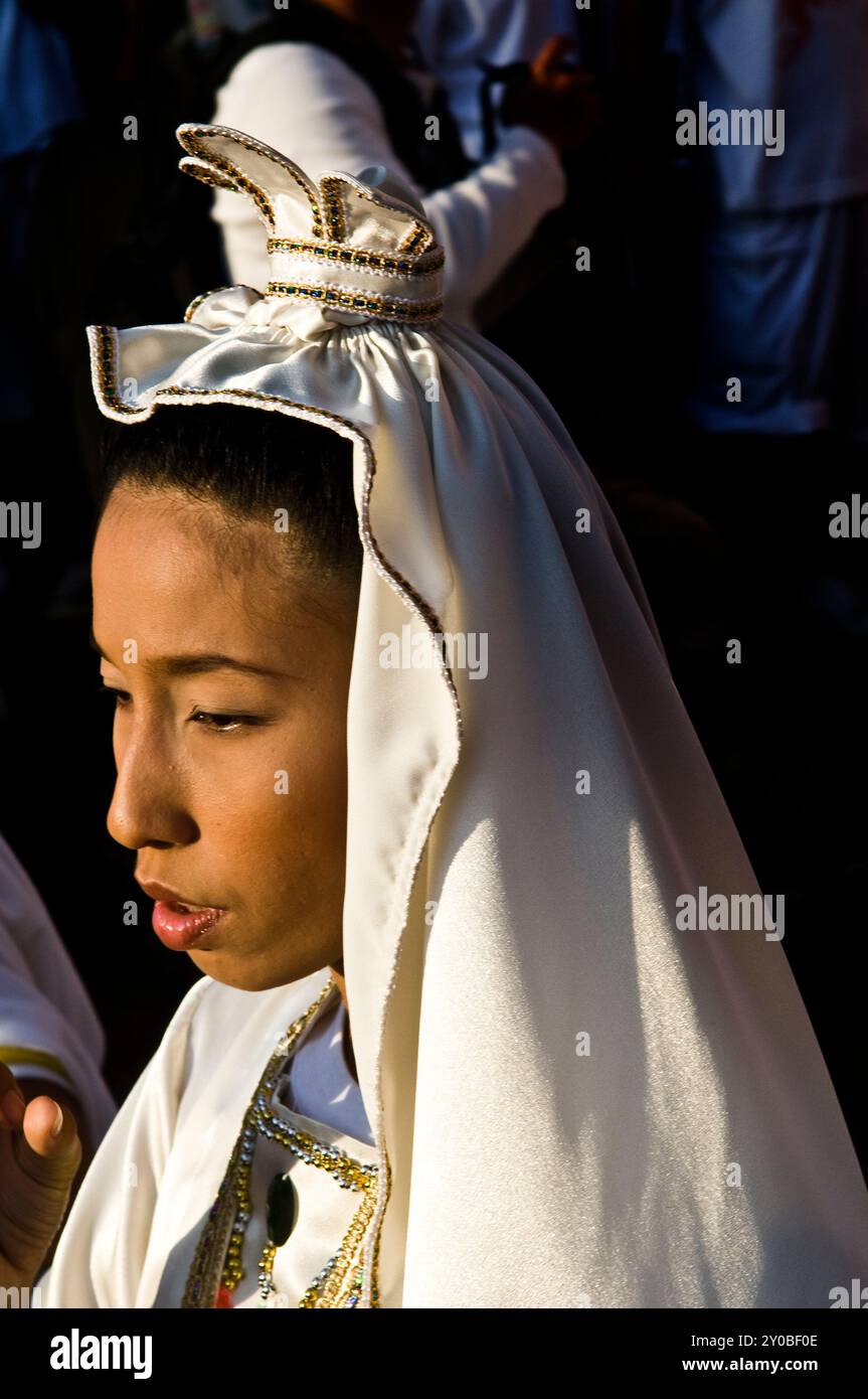 Portrait of a woman spirit medium taken at a parade during the Nine ...