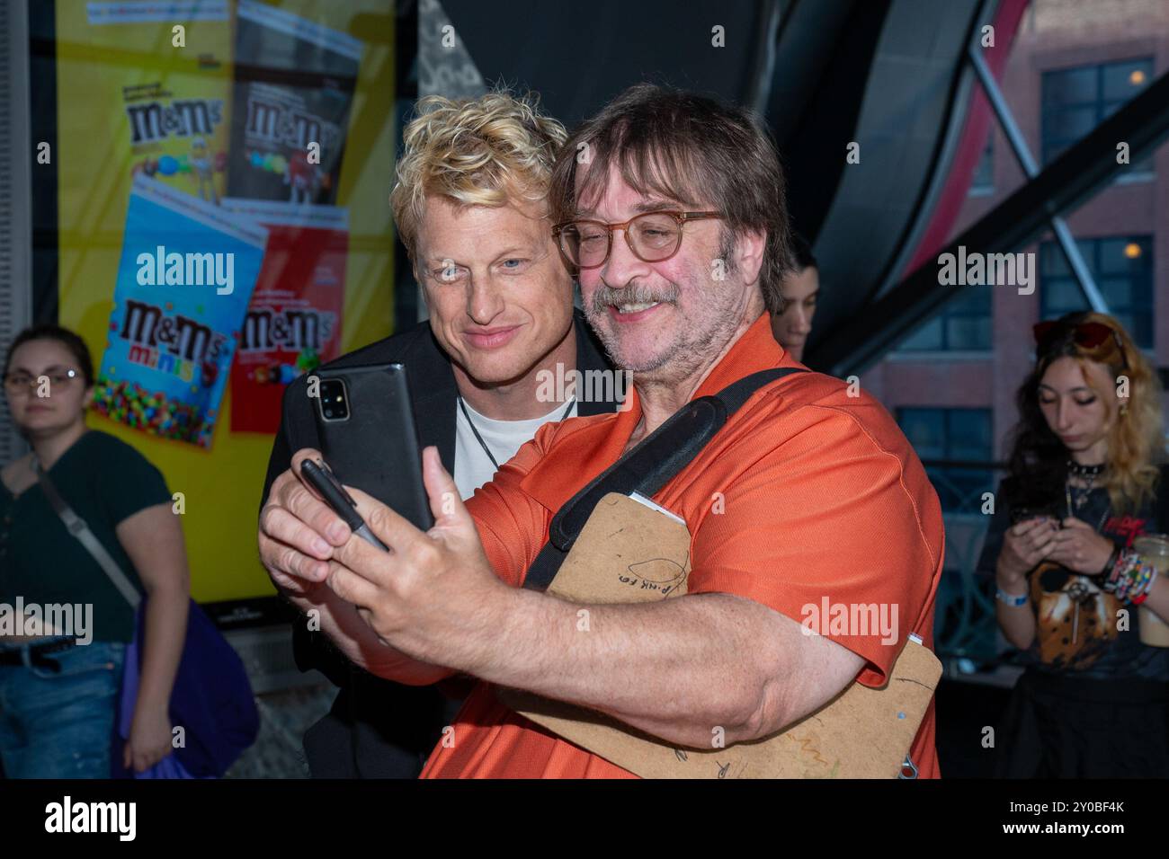 Toronto, Canada. 31st Aug, 2024. Adam MacDonald (L) and a fan pose for ...