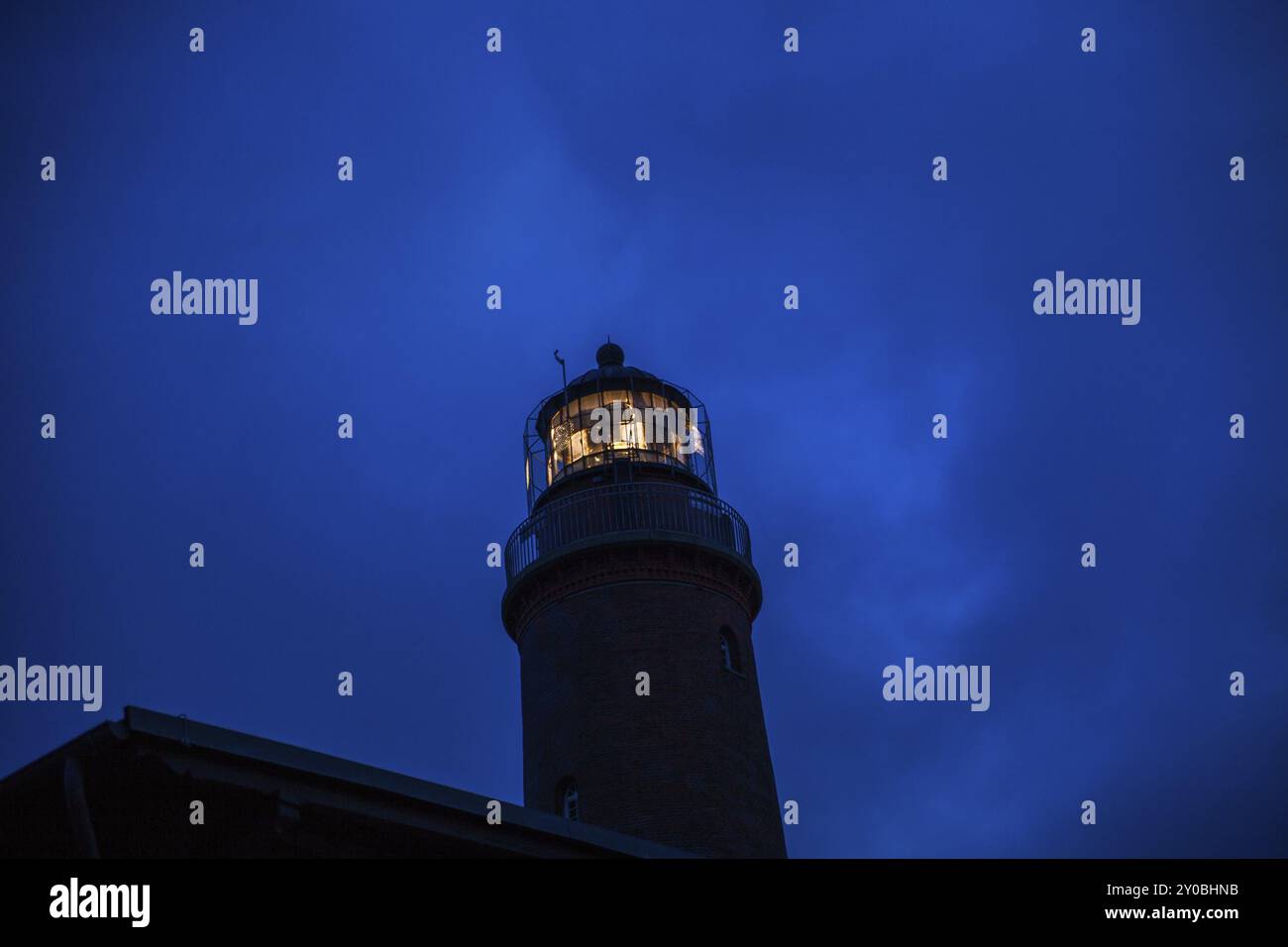 The light of a lighthouse shines in the darkness Stock Photo - Alamy