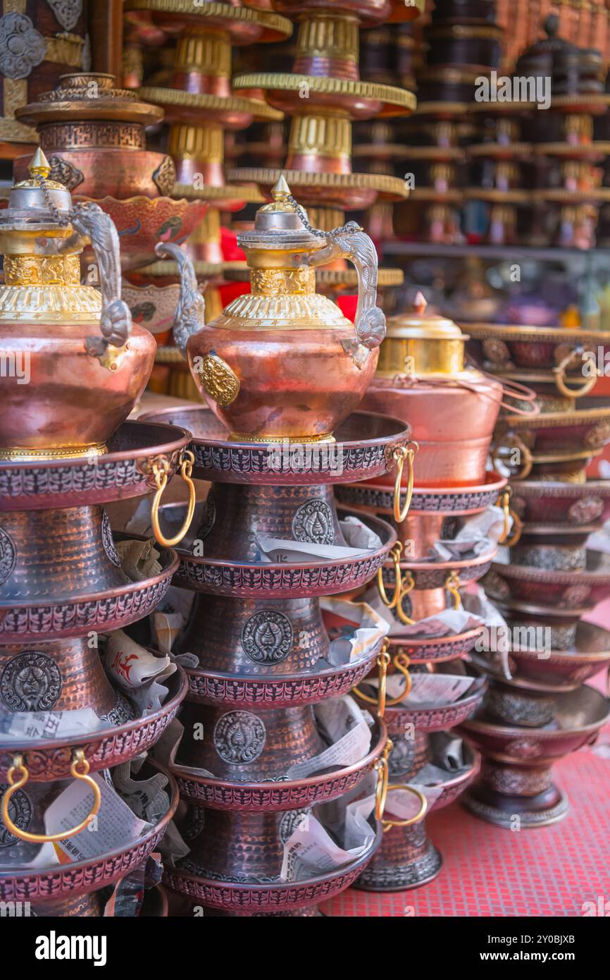 Bronze tea pots, merchandise hang, sell in Tibetan market, Lhasa, Tibet ...