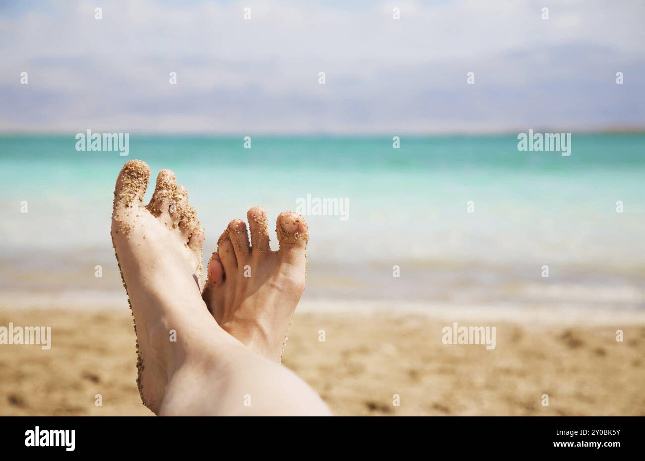 Female Feet On The Dead Sea Background Stock Photo - Alamy