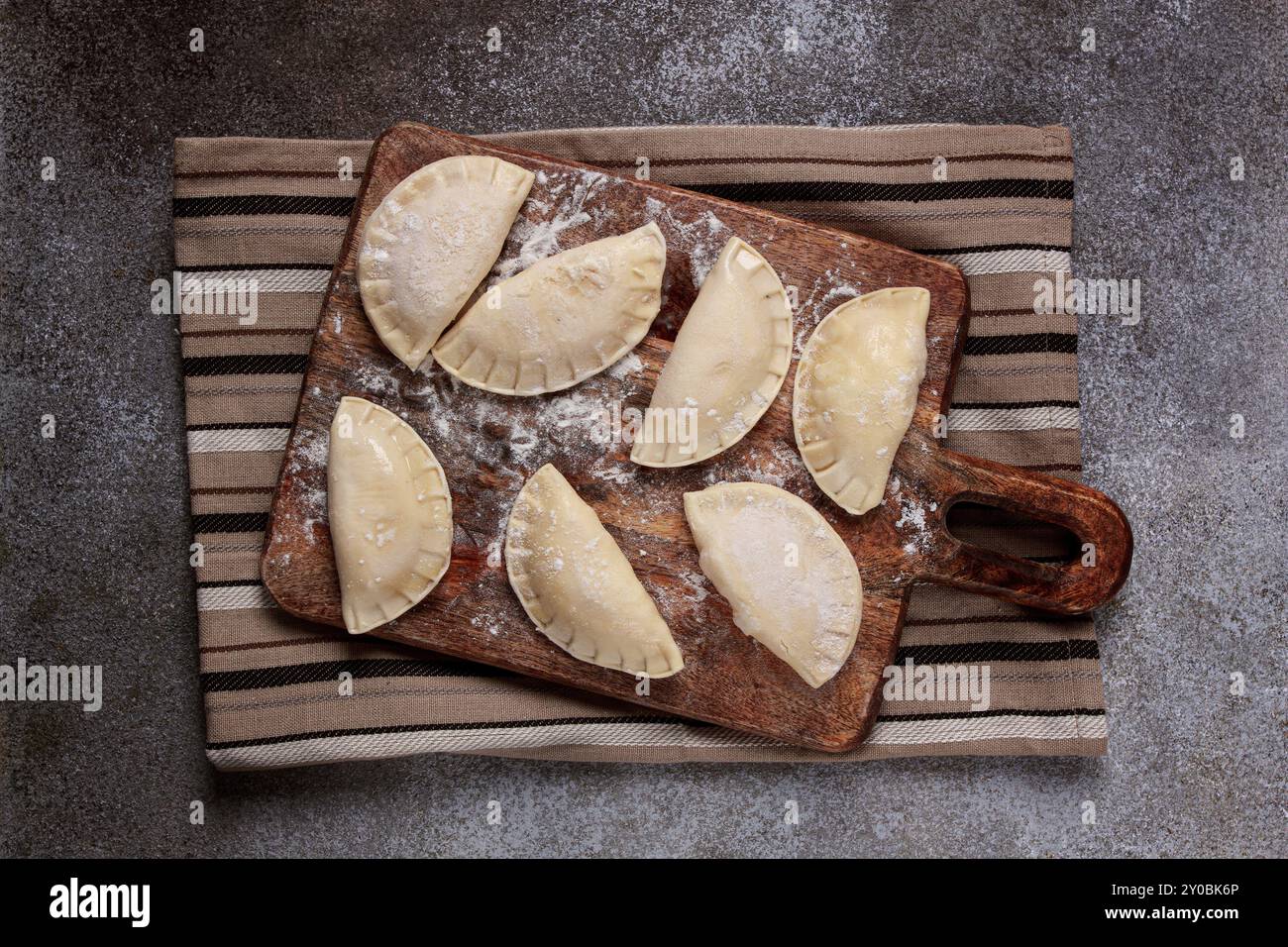 Traditional Polish dish, dumplings, raw, frozen, on a cutting board ...