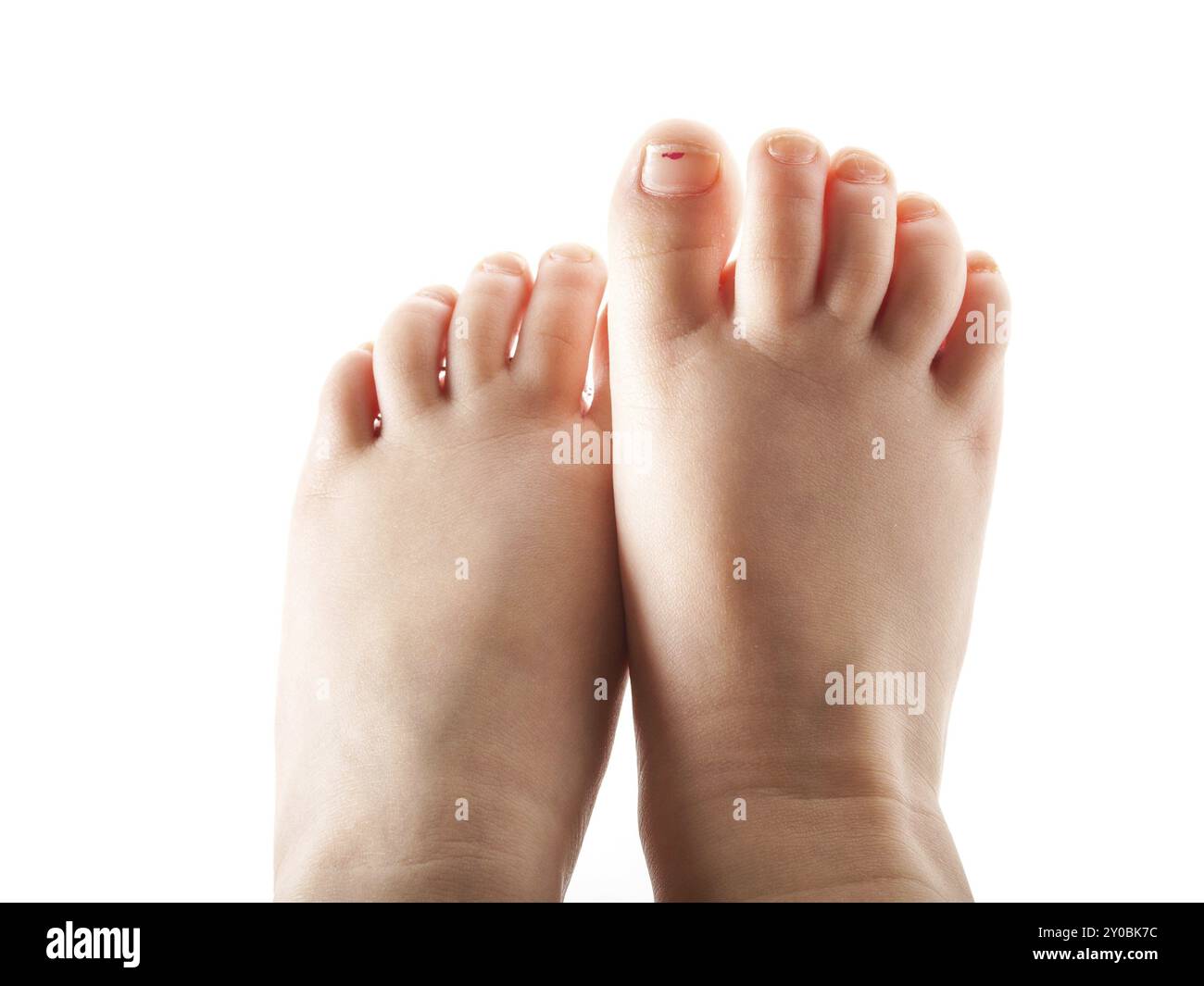 Small feet of a girl, isolated towards white background Stock Photo - Alamy