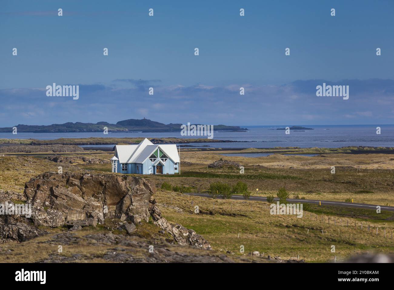 Lonely blue house with a white roof standing alone in the landscape ...