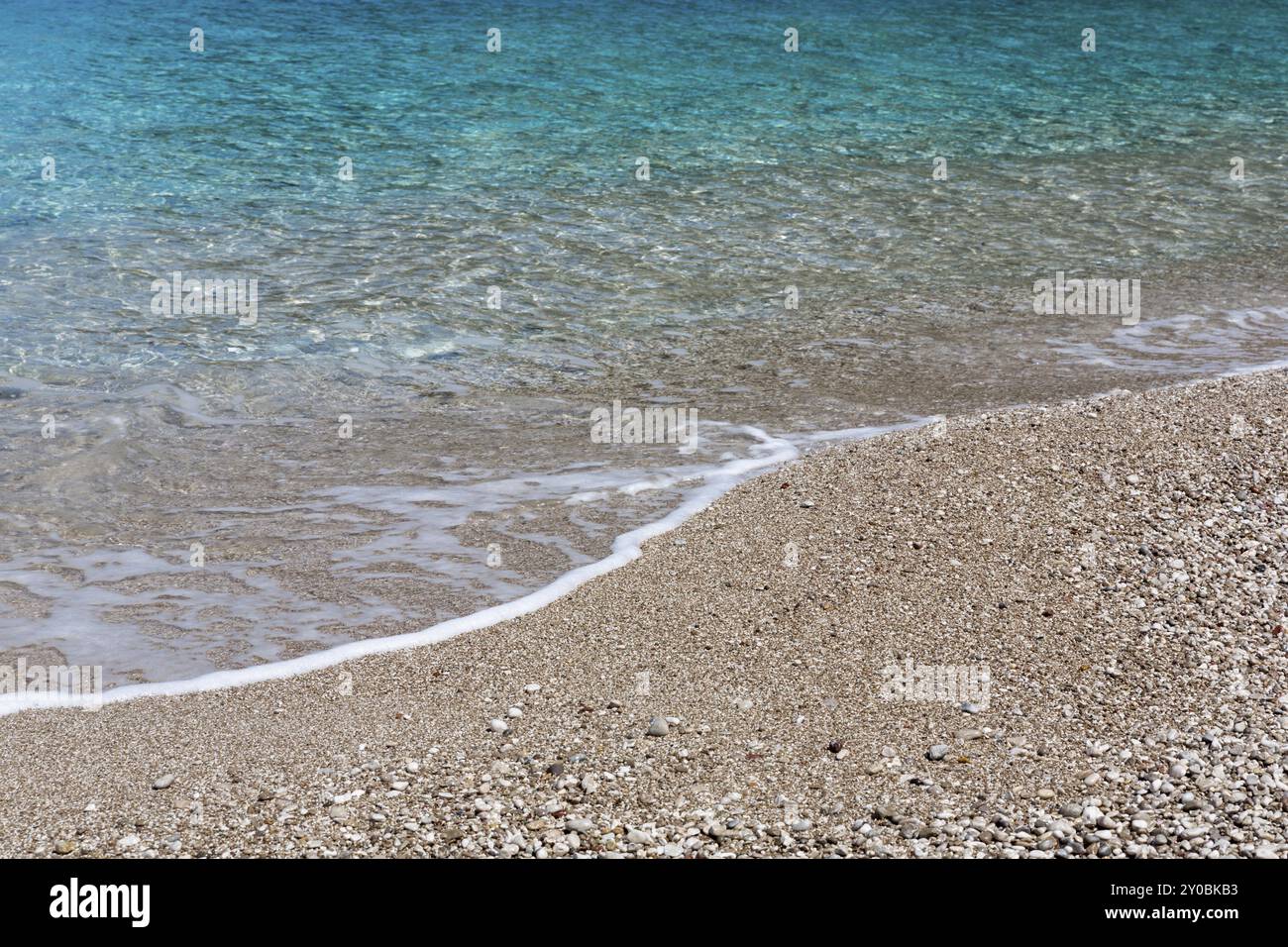 Pebble beach in Greece Stock Photo - Alamy