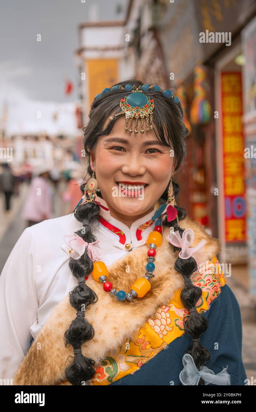 Lhasa, Tibet, July 3, 2022: Lady posing at ancient temple door in a ...