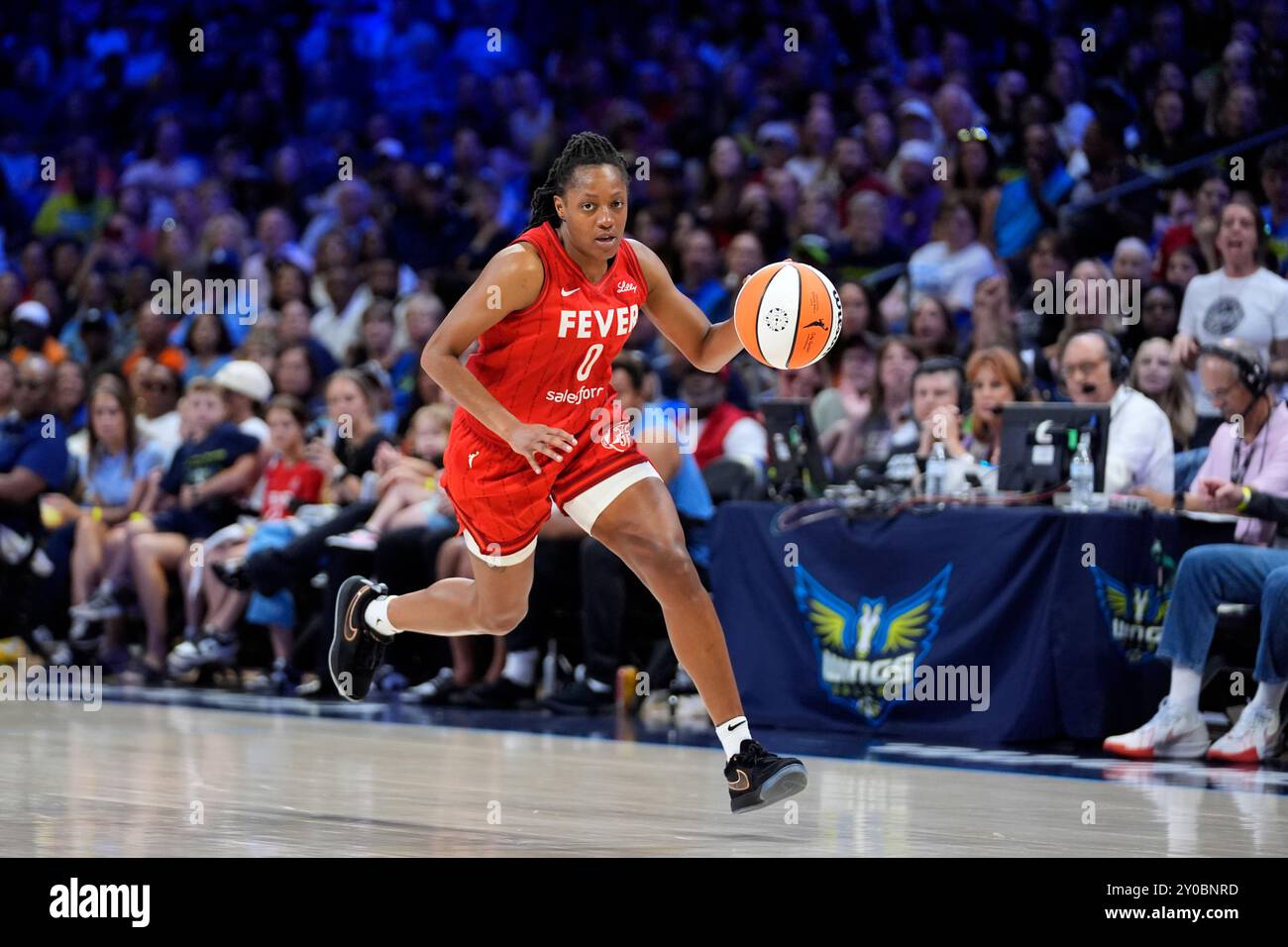 Indiana Fever guard Kelsey Mitchell handles the ball as she works ...
