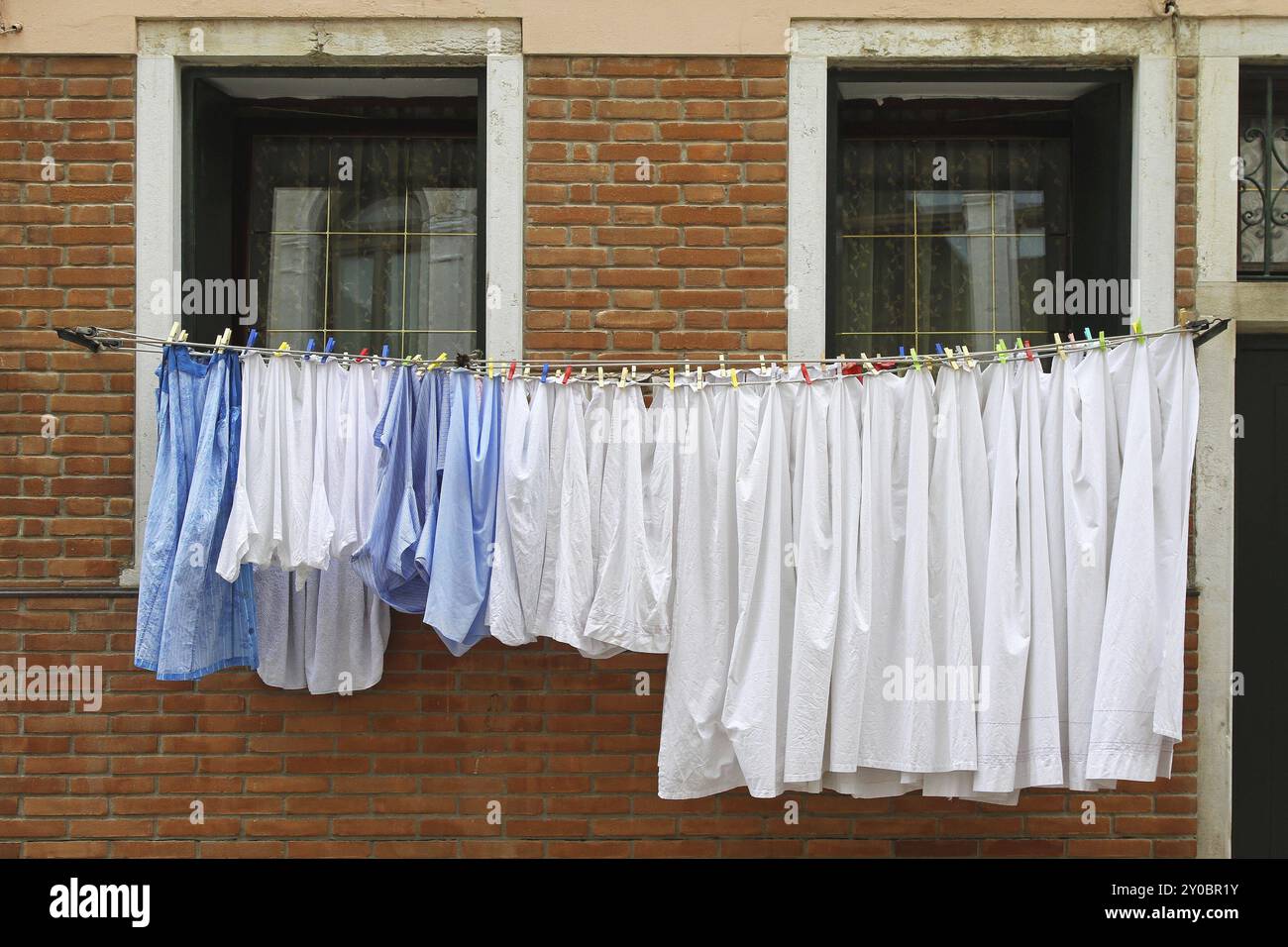 Fresh and clean clothes at window line Stock Photo - Alamy