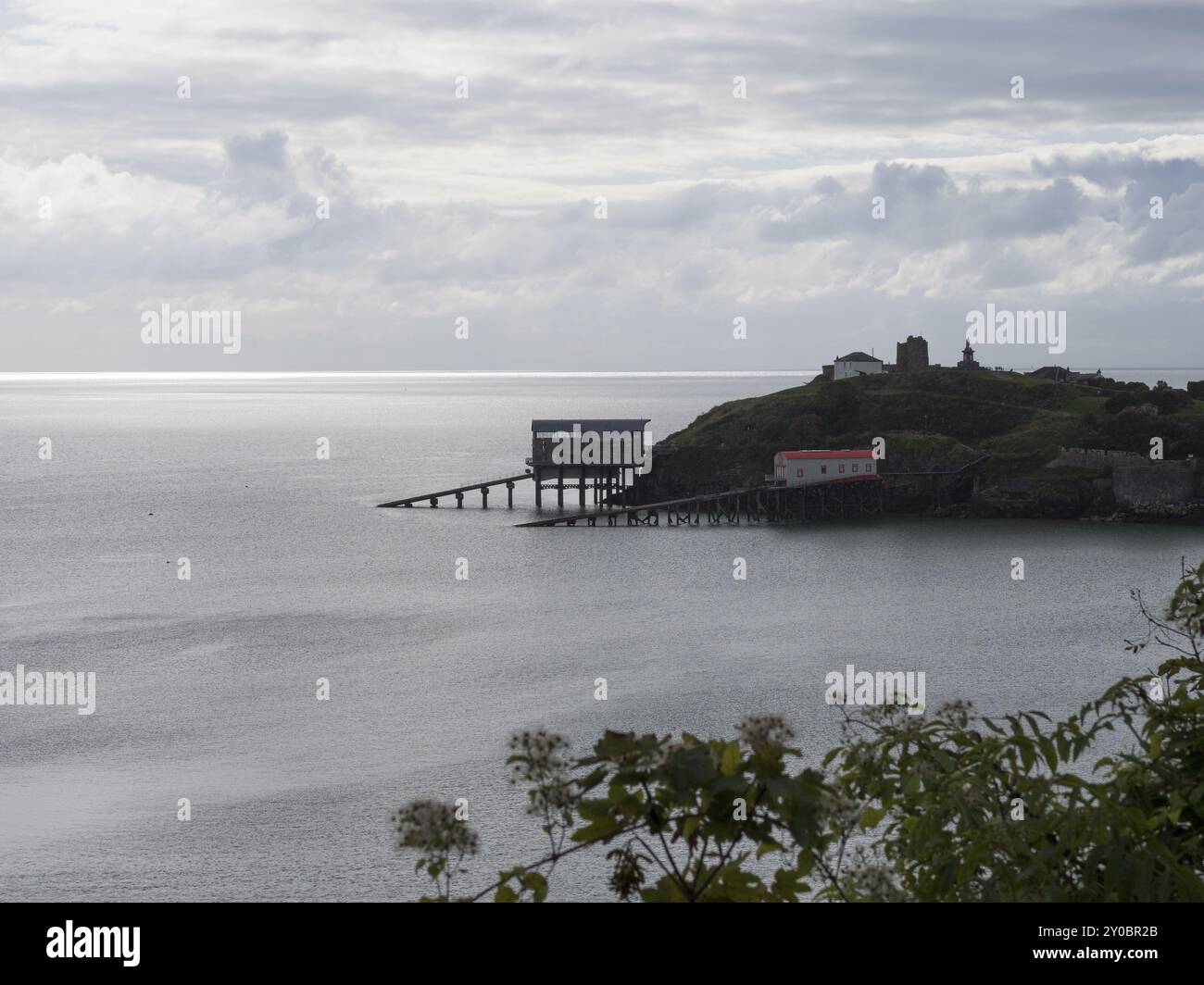 The ruins of Tenby Castle with lifeboat station houses on the Welsh ...