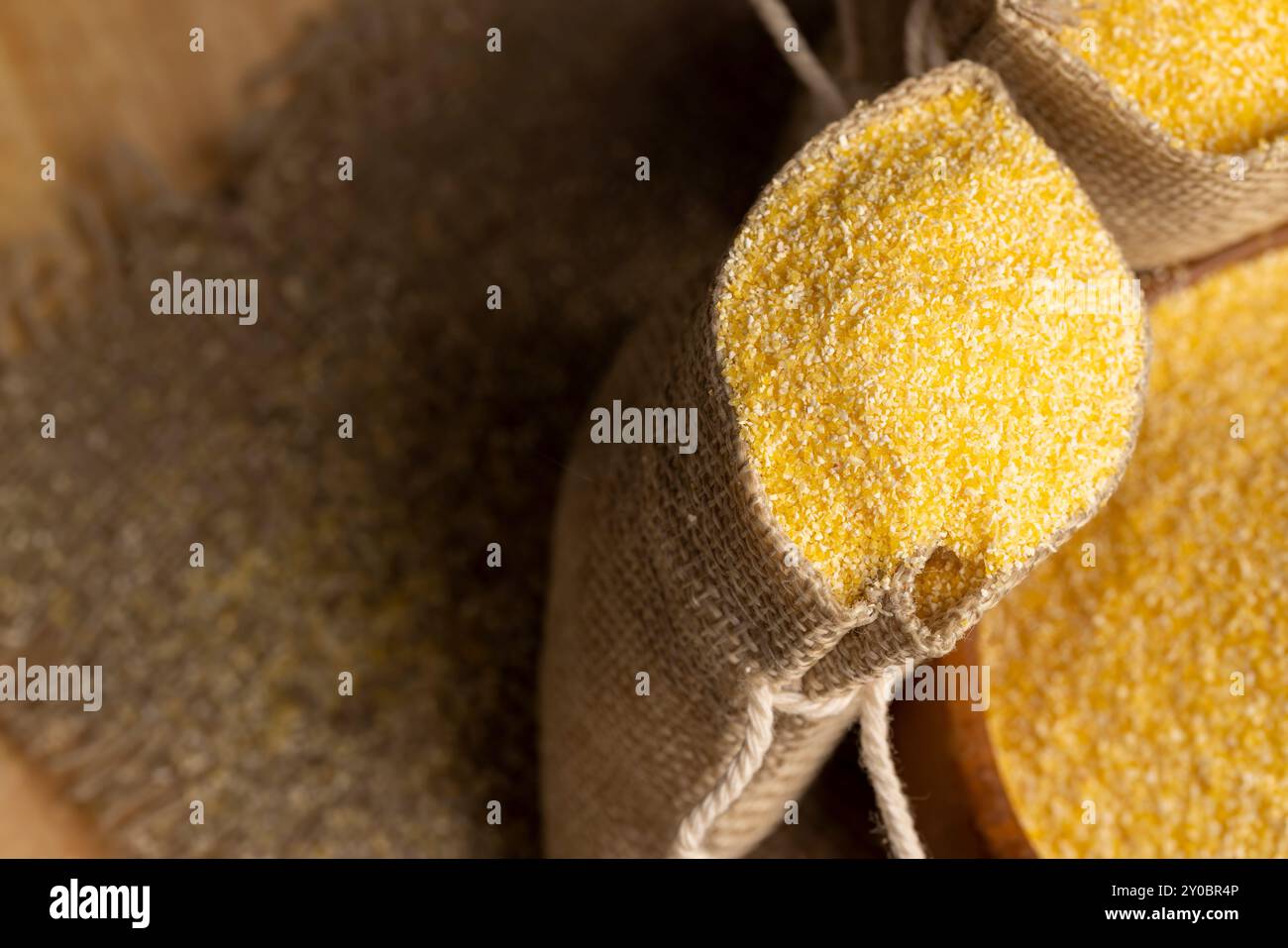 Dry corn flour poured into a linen bag for making porridge, high ...