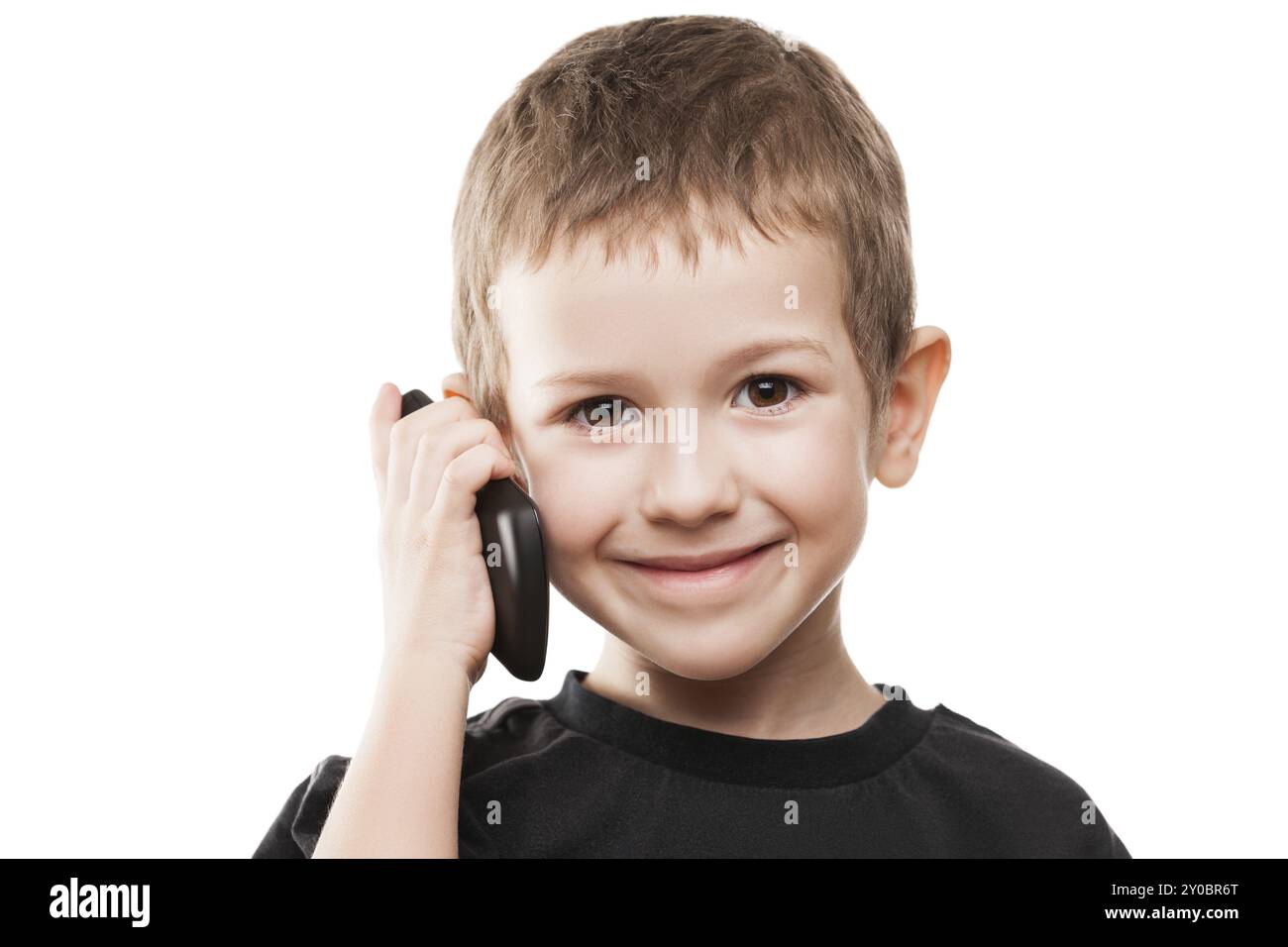 Little smiling child boy hand holding mobile phone or smartphone white ...