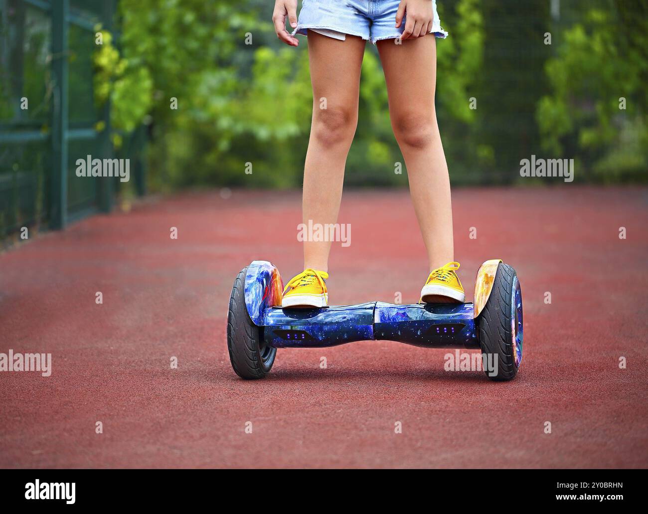 Feet of the little girl riding on a segway. Close up Stock Photo - Alamy