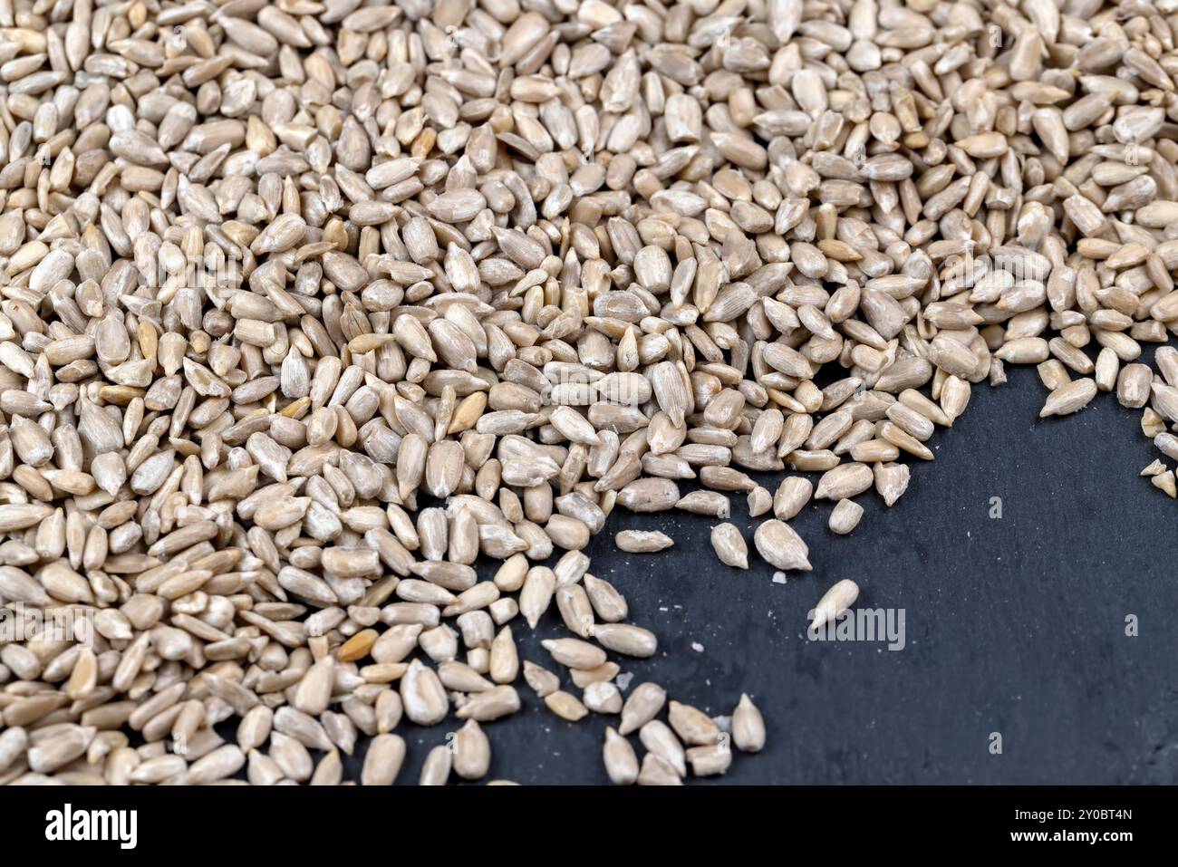 Sunflower seeds peeled from the black shell, scattered sunflower seeds ...