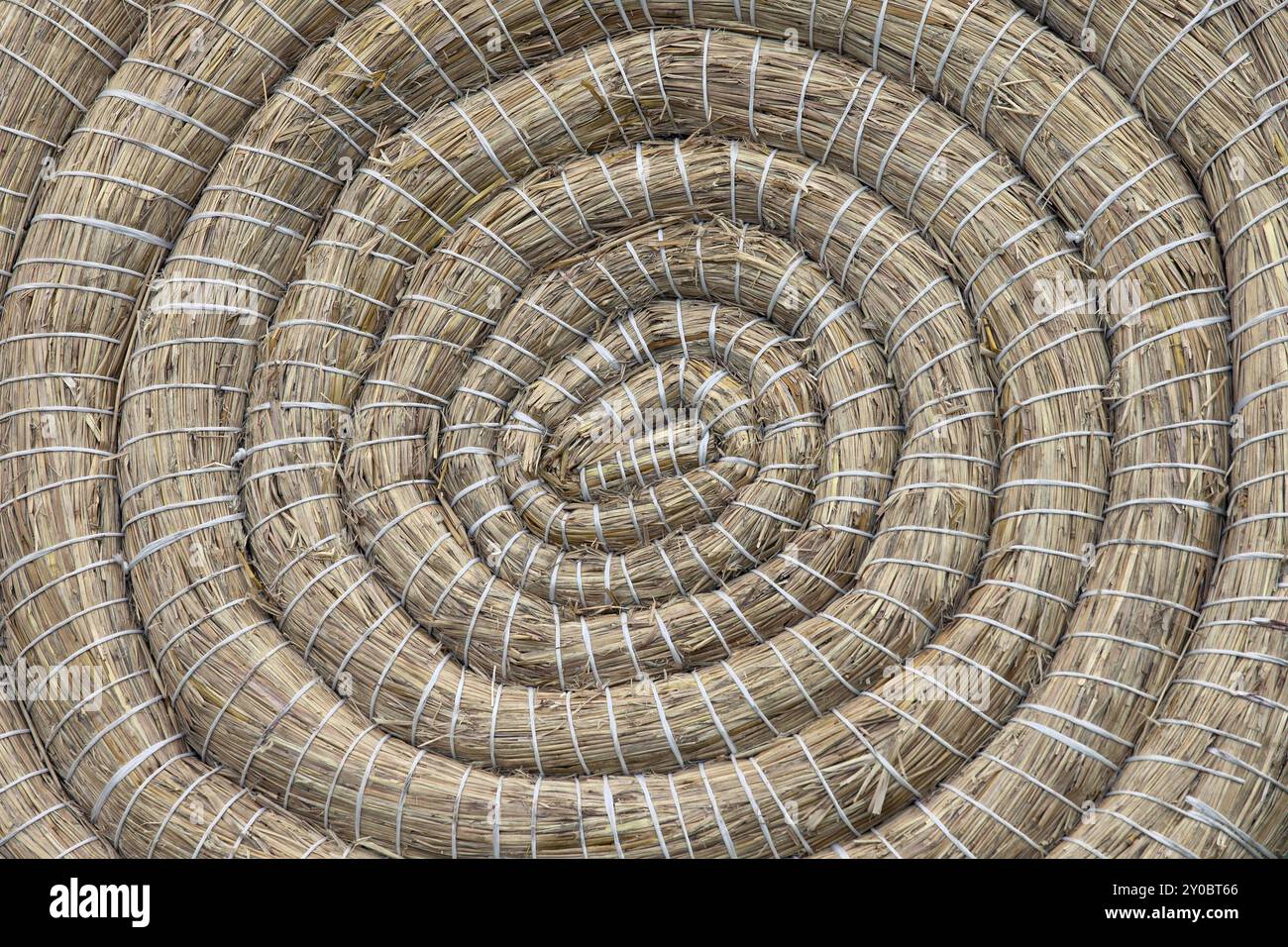 Closeup for background on traditional archery round coiled straw target ...