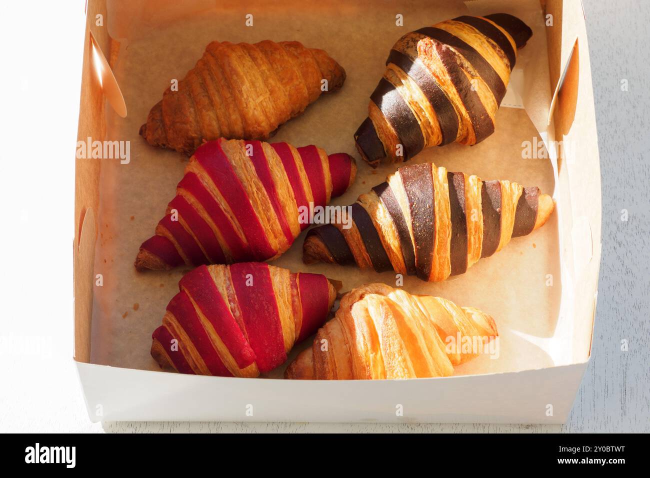Fresh many different baked croissants in delivery box Stock Photo - Alamy