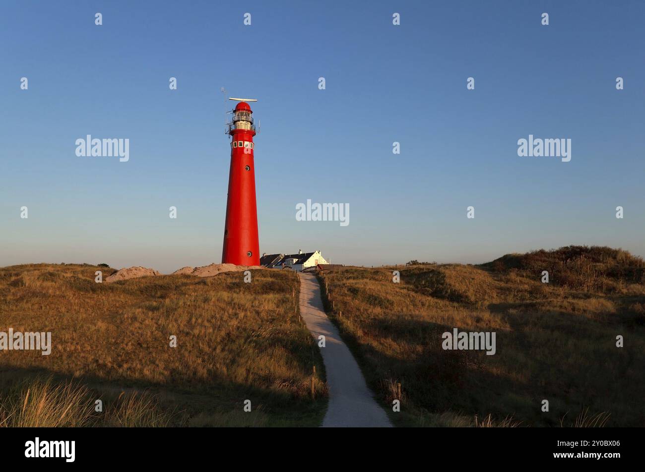 Road to red lighthouse and blue sky, Netherlands Stock Photo - Alamy